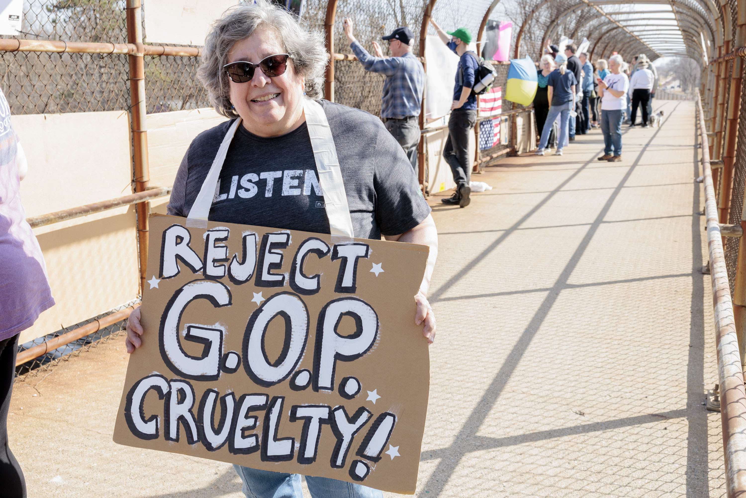 Demonstrators protest Trump Administration on four Ann Arbor pedestrian ...