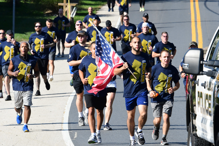 Warren County police hit the streets in Torch Run to benefit Special ...