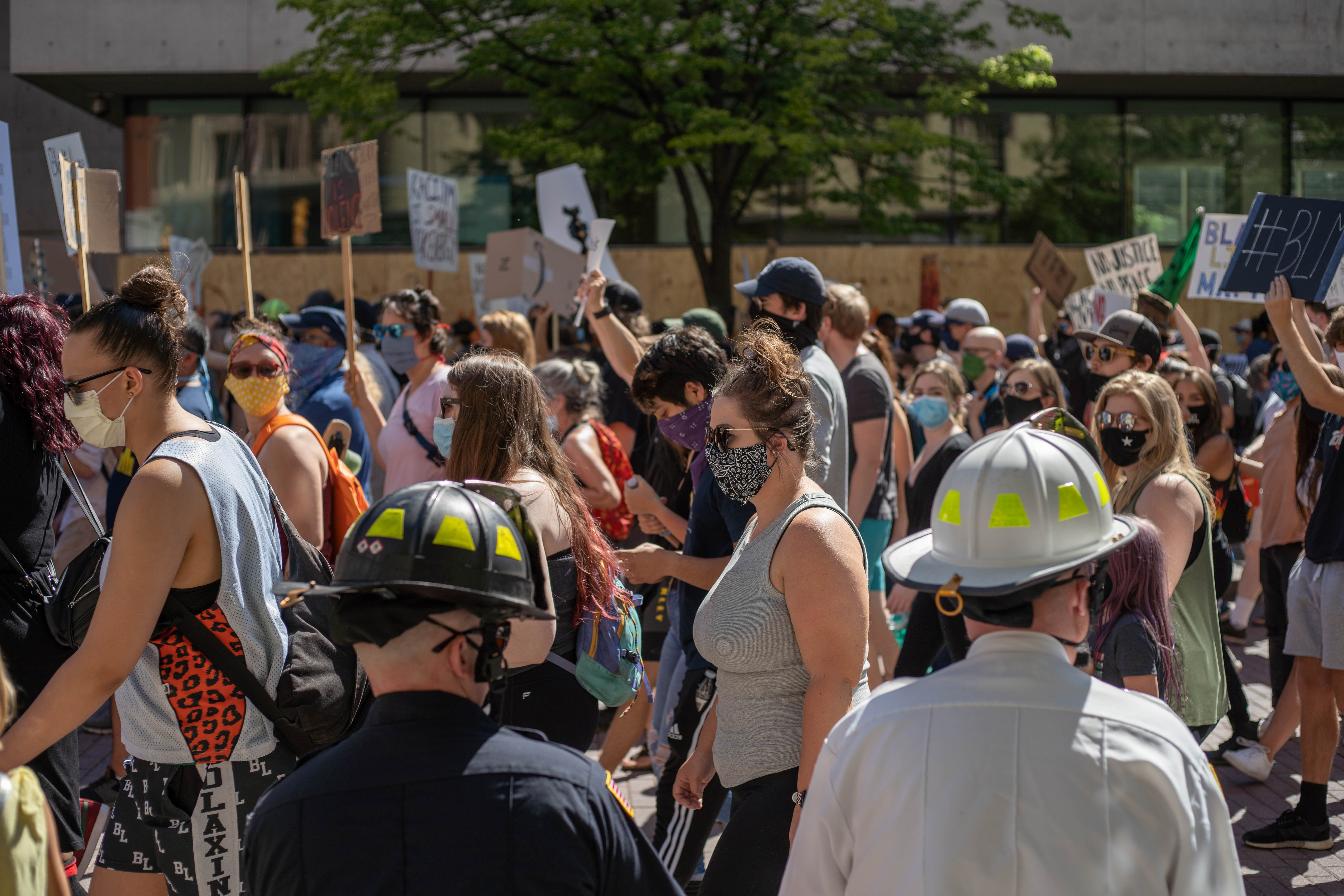 Protesters march against police brutality throughout downtown Grand ...