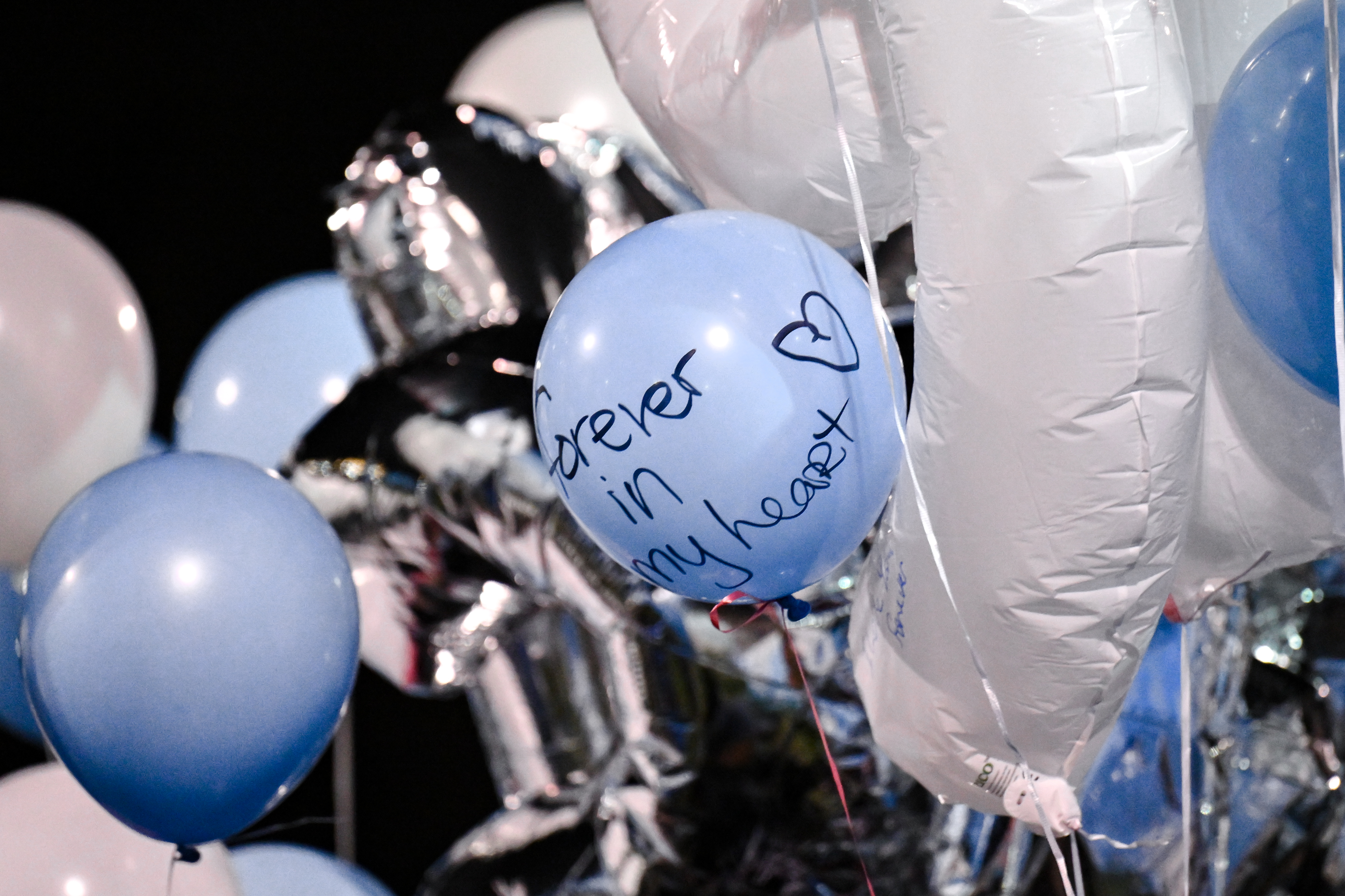 Third victim in Newark shooting dies. Community holds a balloon release ...