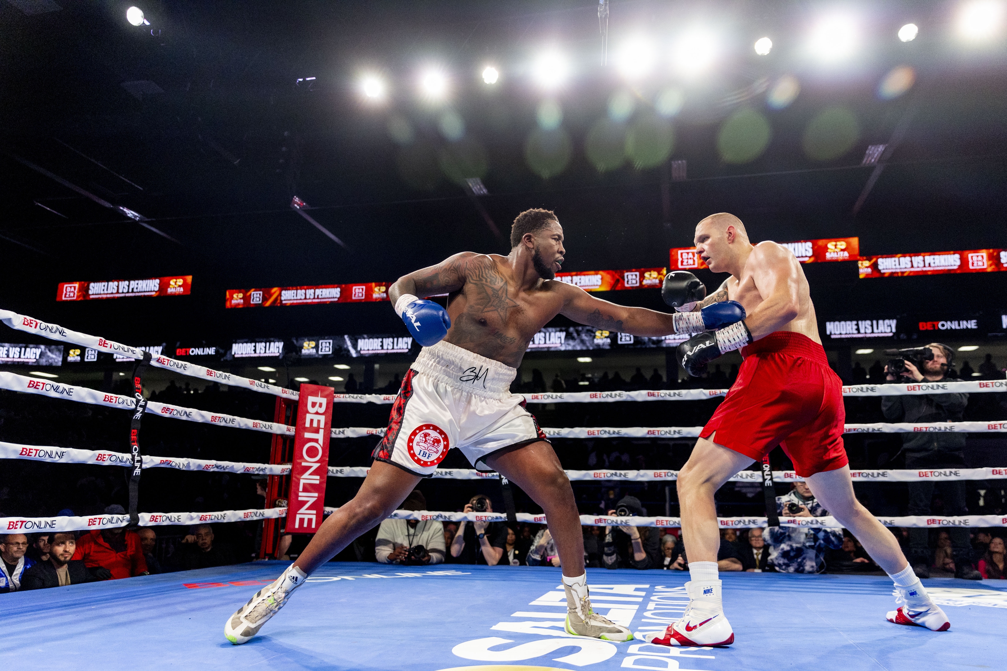 Boxers fly out of the ring and into crowd in WWE style at Michigan bout ...