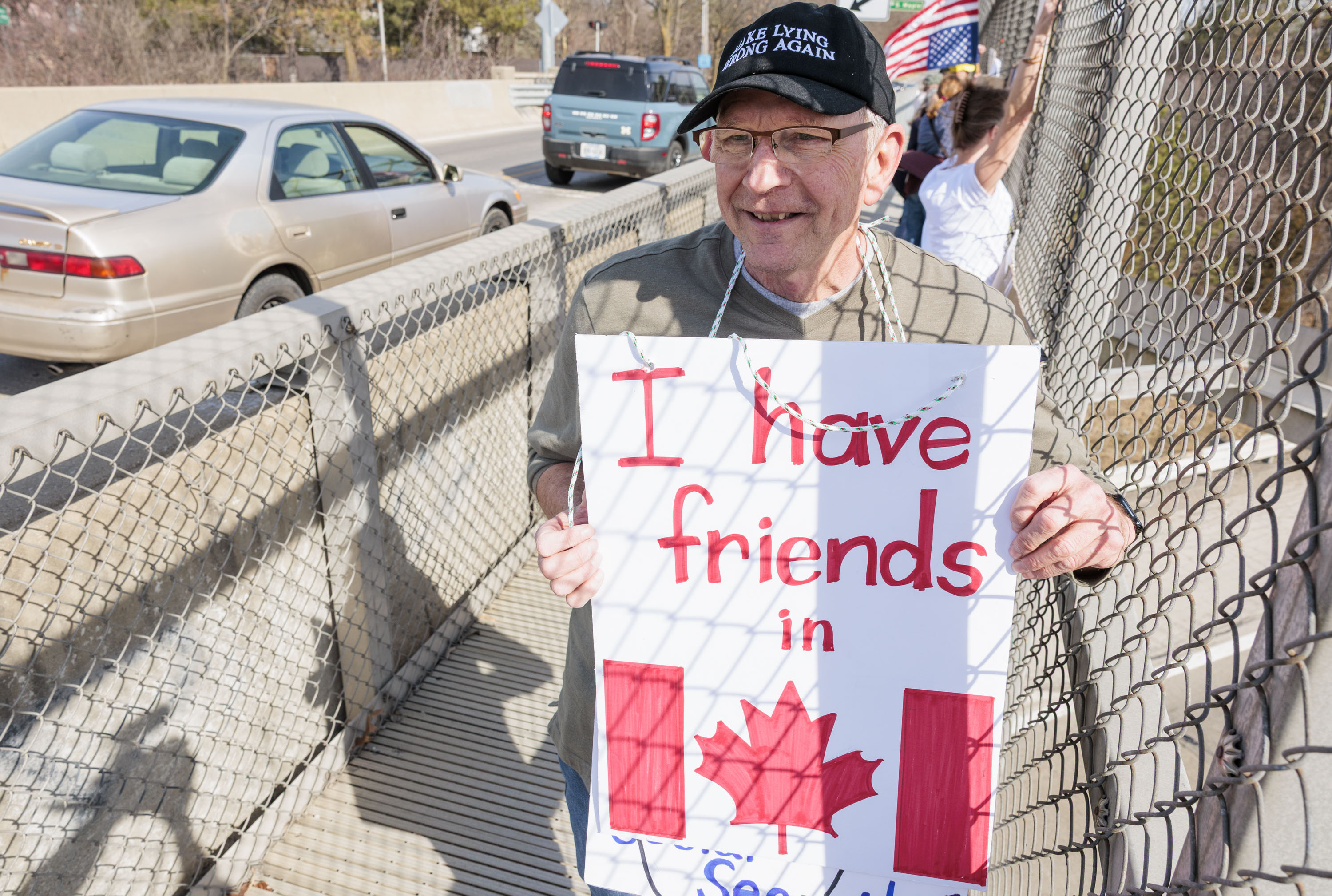 Demonstrators protest Trump Administration on four Ann Arbor pedestrian ...