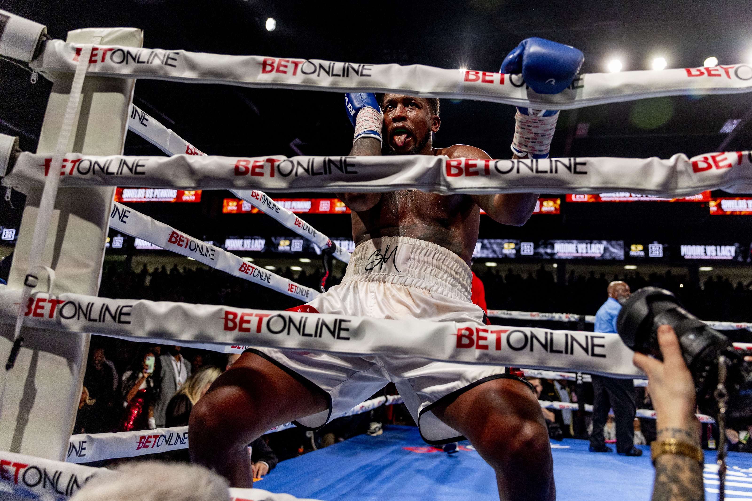 Boxers fly out of the ring and into crowd in WWE style at Michigan bout ...