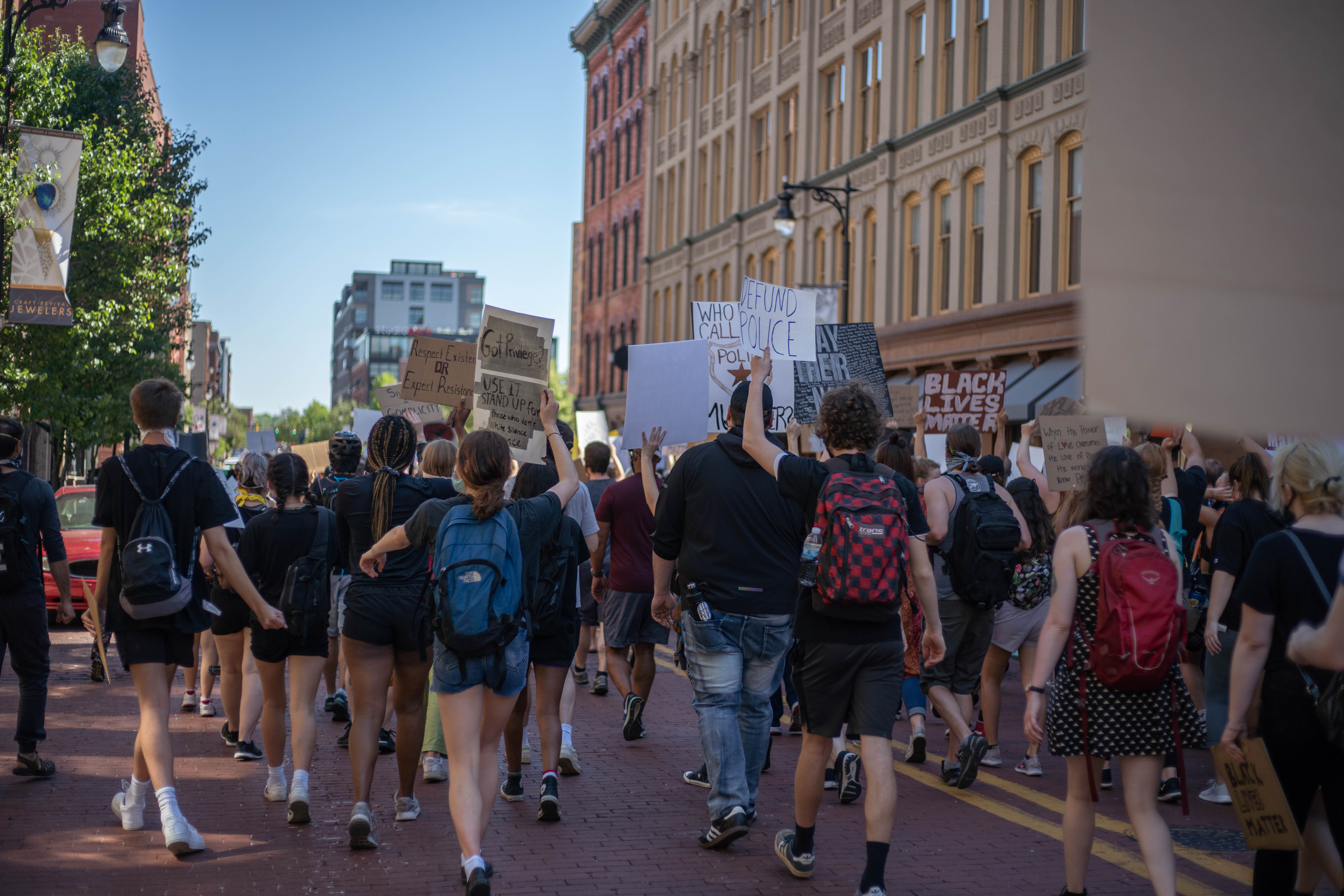 Protesters march against police brutality throughout downtown Grand ...