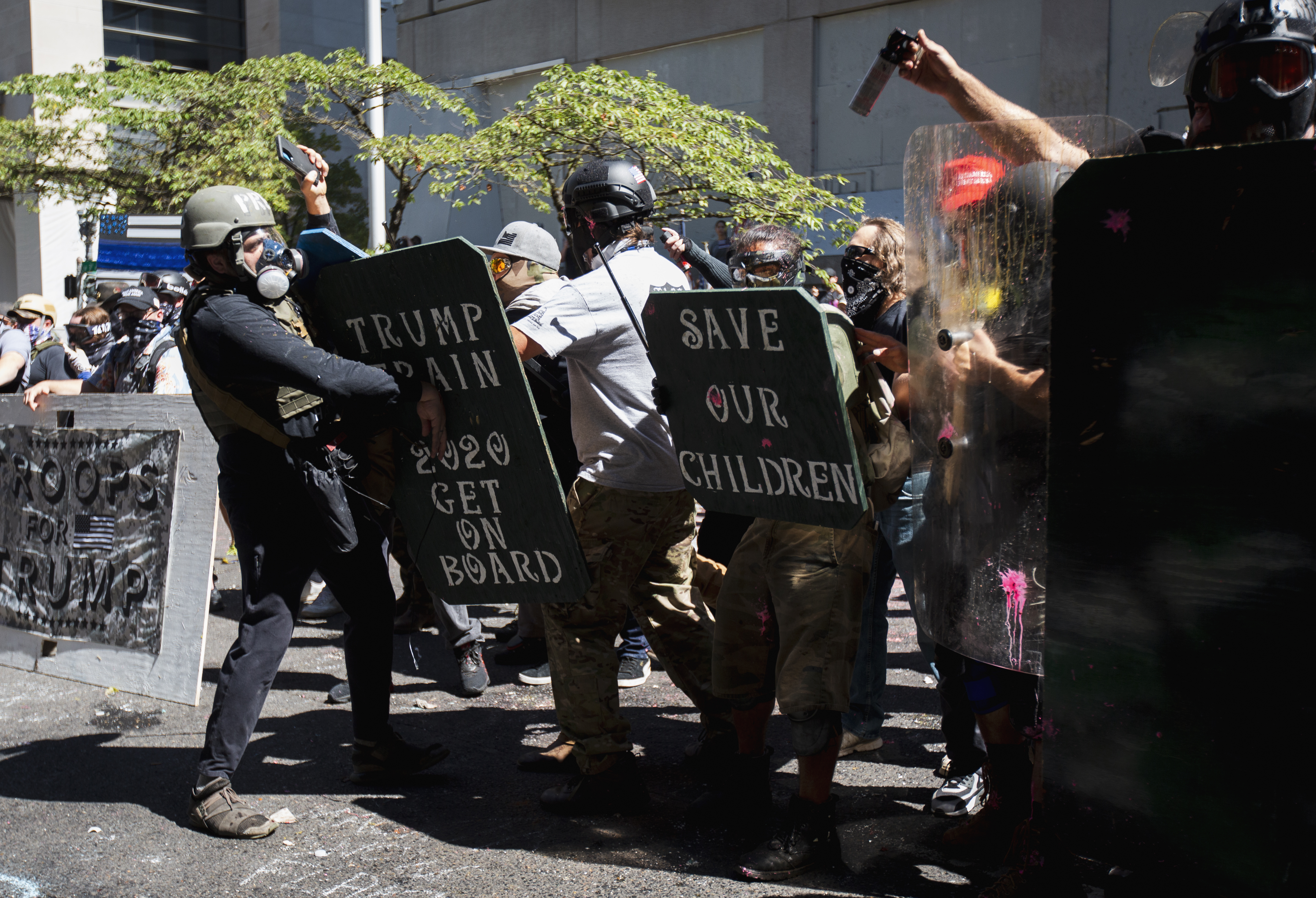 Opposing rallies battle with mace, paint balls and rocks near Justice ...