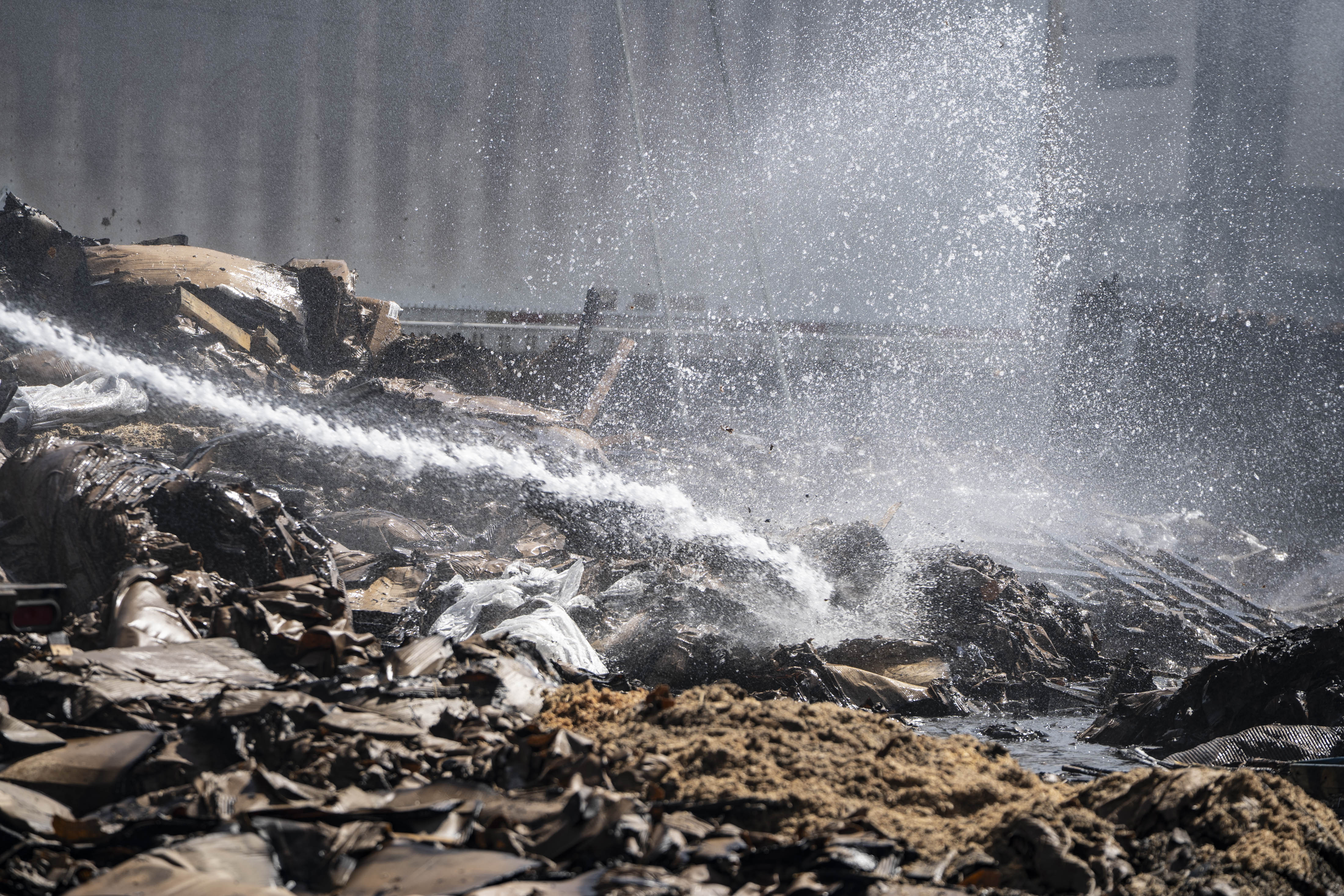 Firefighters work to extinguish a fire at D.I. Enterprises - mlive.com