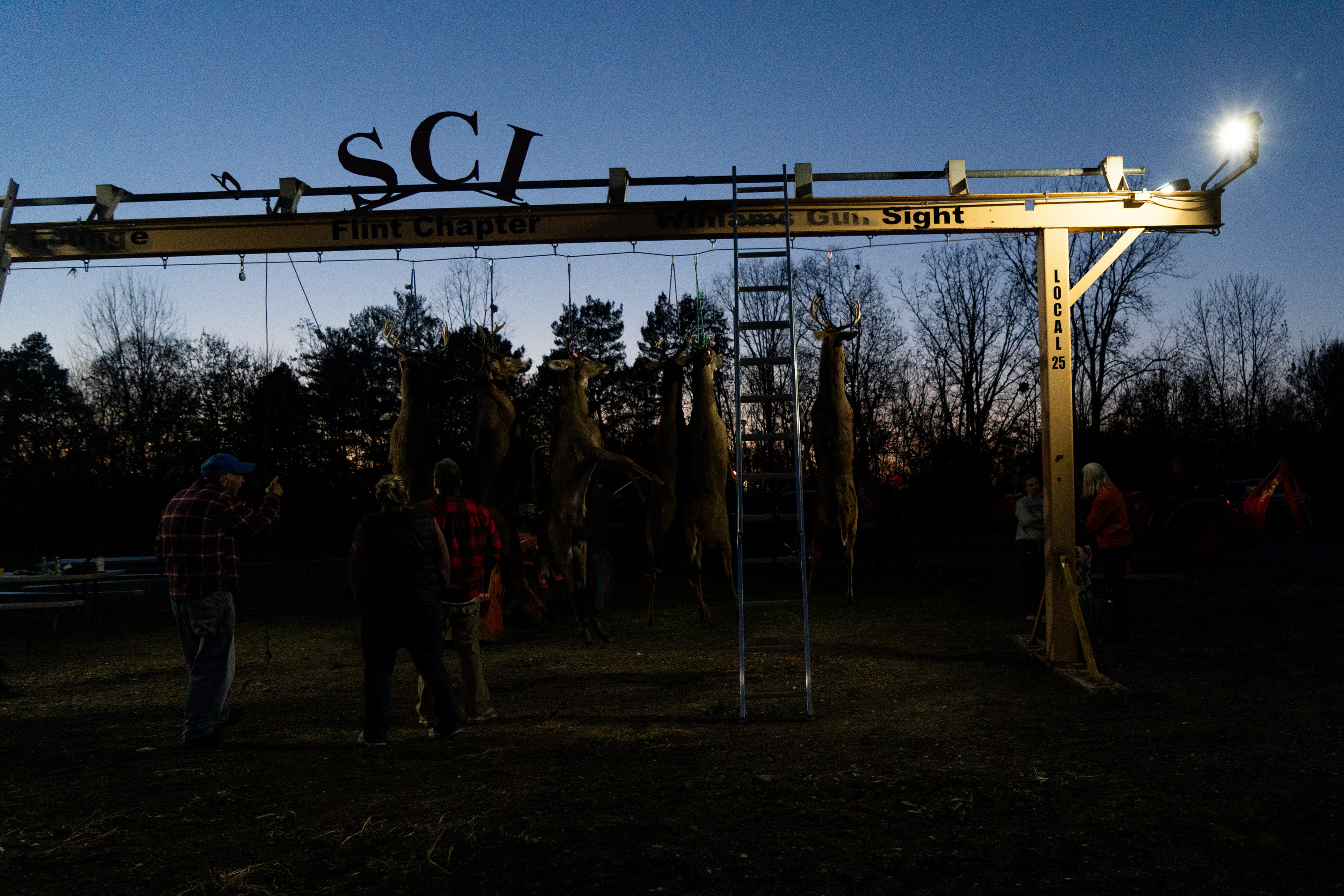 Hunters make their way to the buck poles on opening day - mlive.com