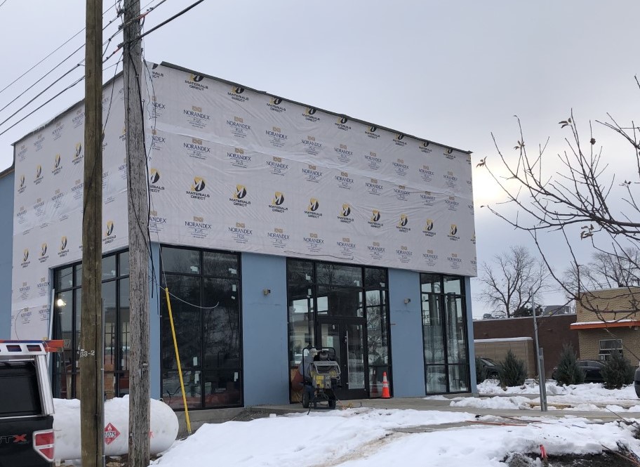 What retail store is being built on busy commercial strip in DeWitt?