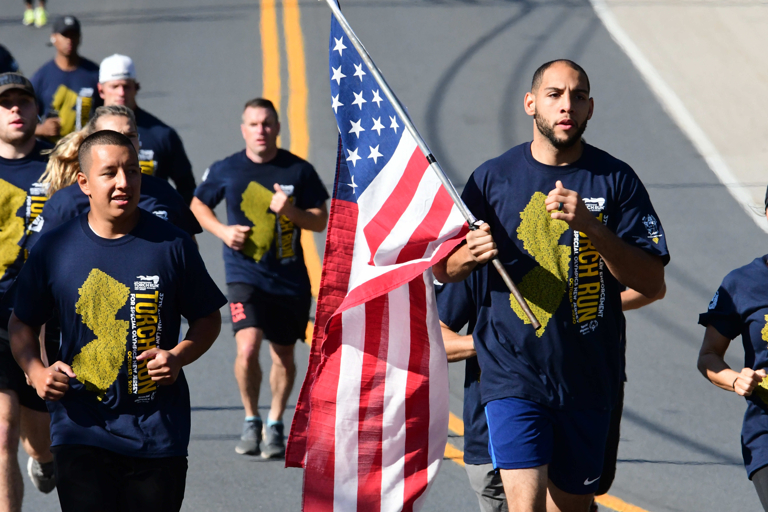 Warren County police hit the streets in Torch Run to benefit Special ...