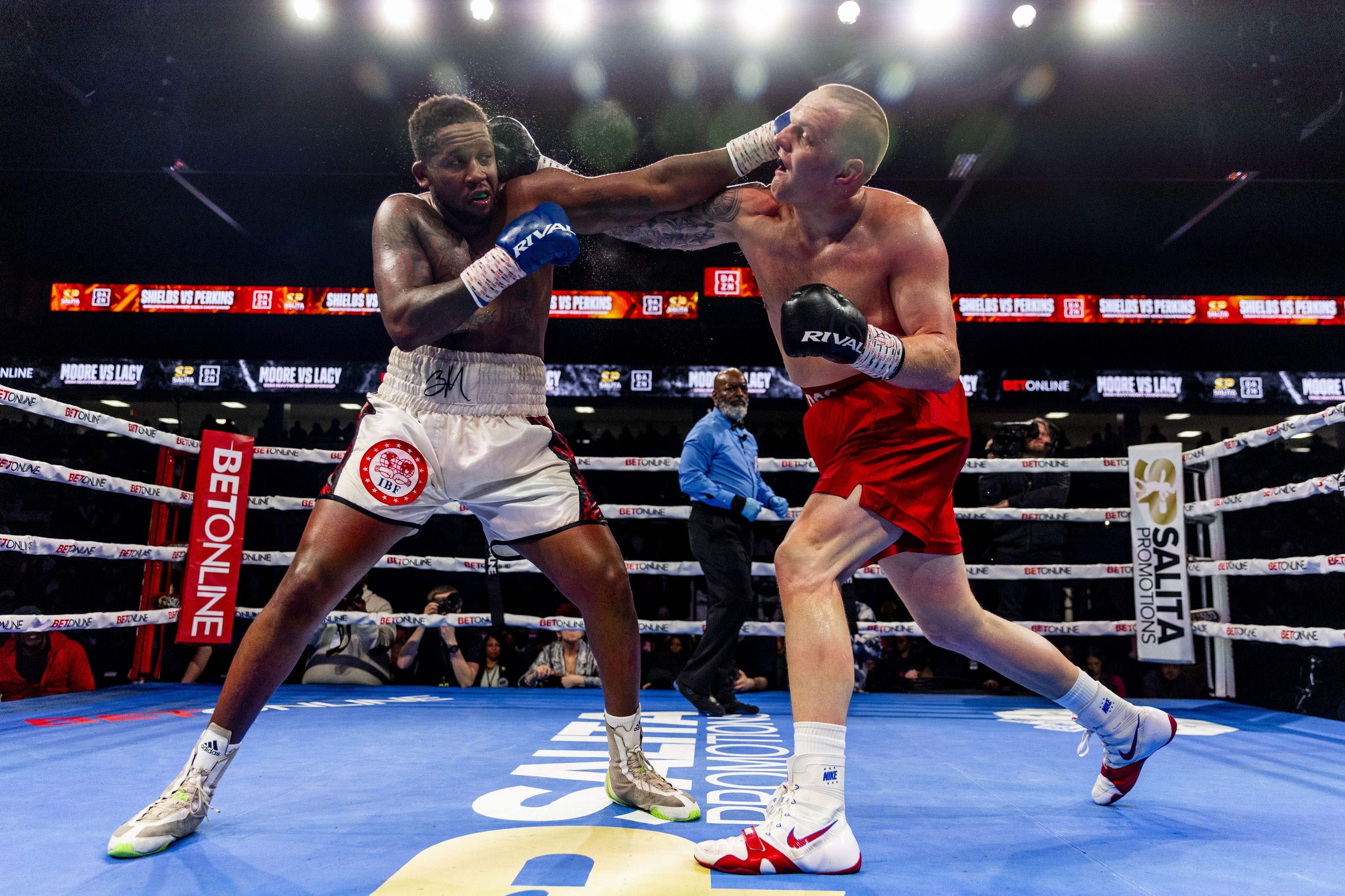 Boxers fly out of the ring and into crowd in WWE style at Michigan bout ...