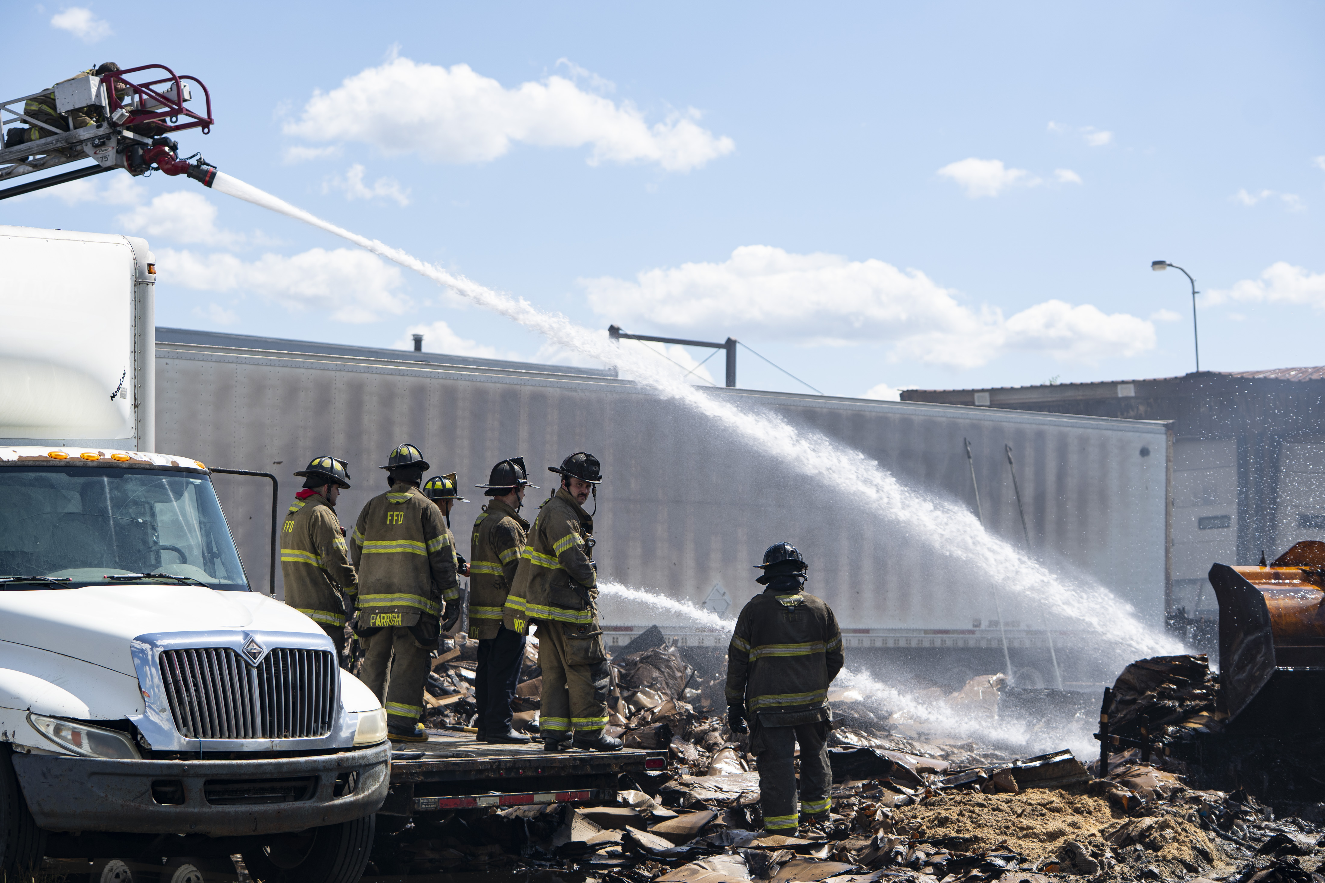 Firefighters work to extinguish a fire at D.I. Enterprises - mlive.com