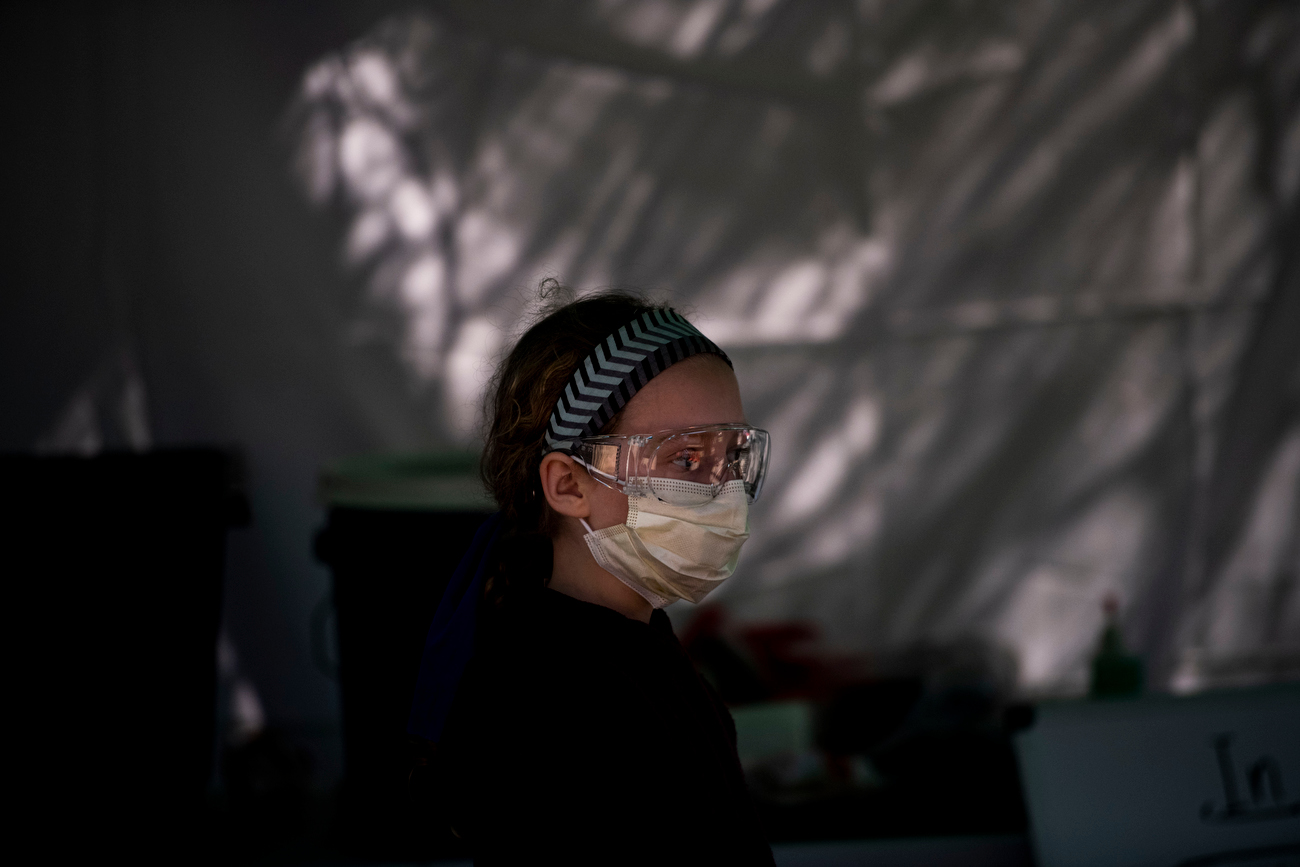 Kevin Leeser and his children prepare shields for healthcare workers ...