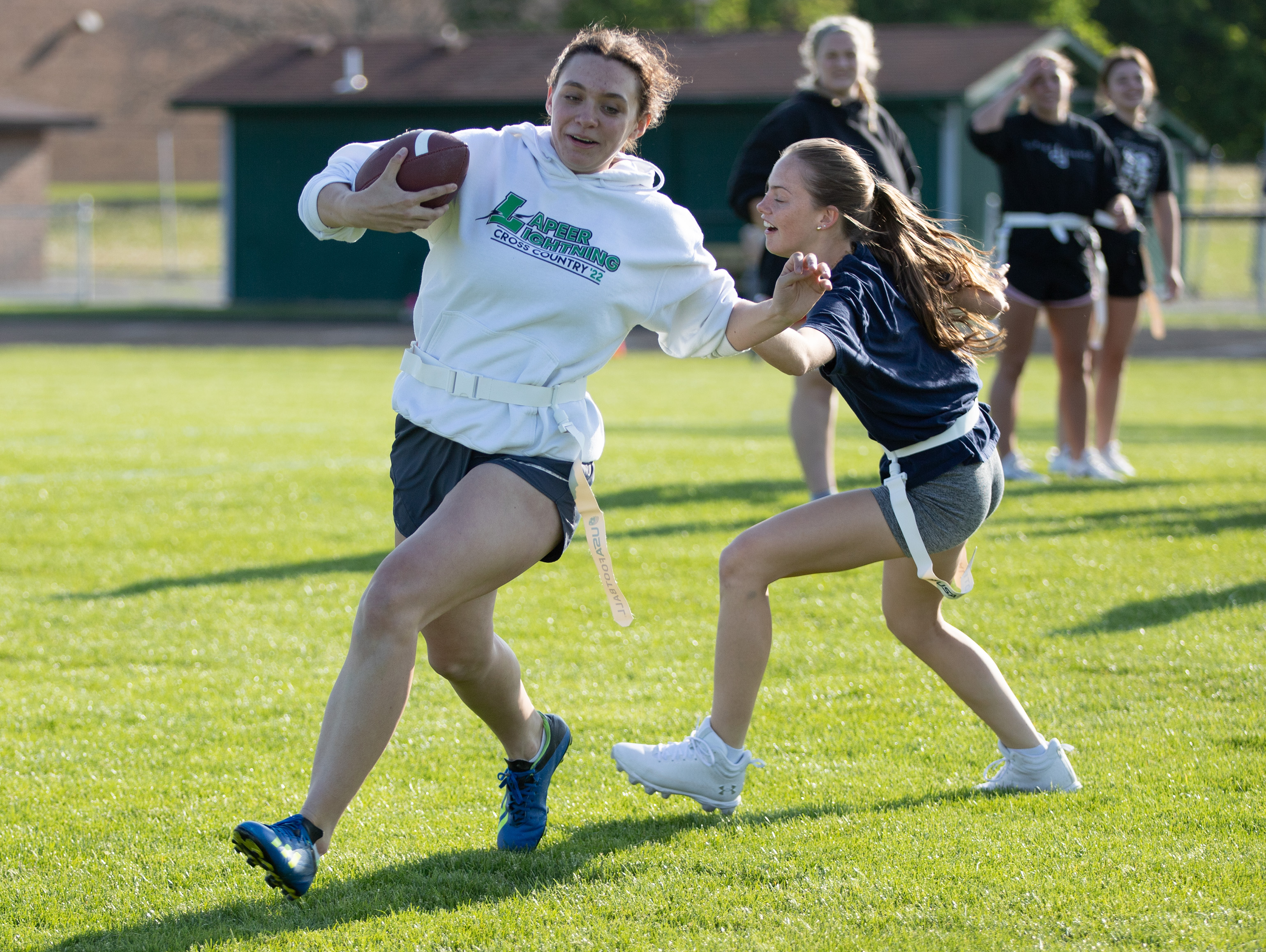 Lapeer high school girls participate in flag football pilot league ...