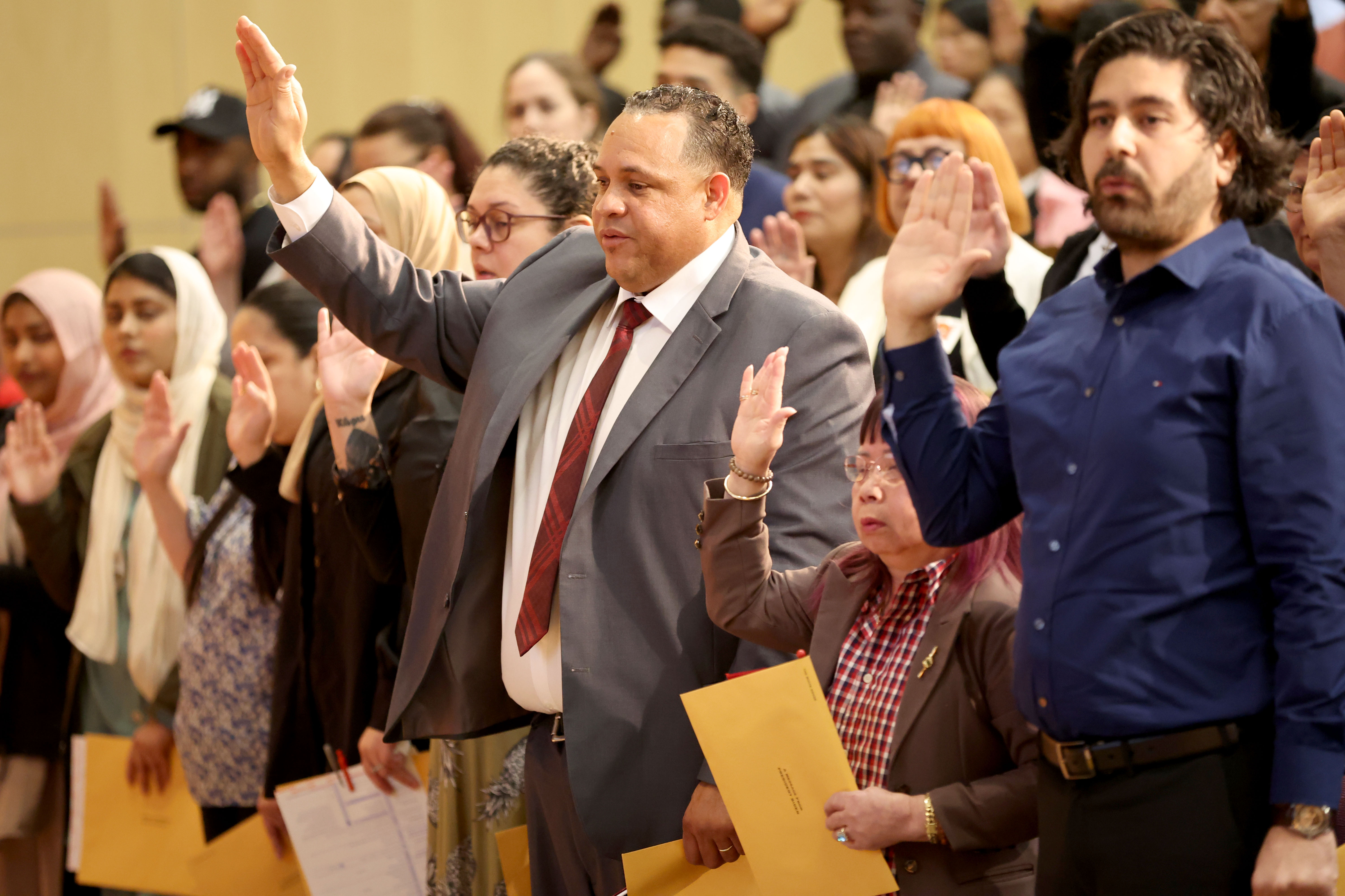Eighty new citizens welcomed at OCC ceremony - syracuse.com