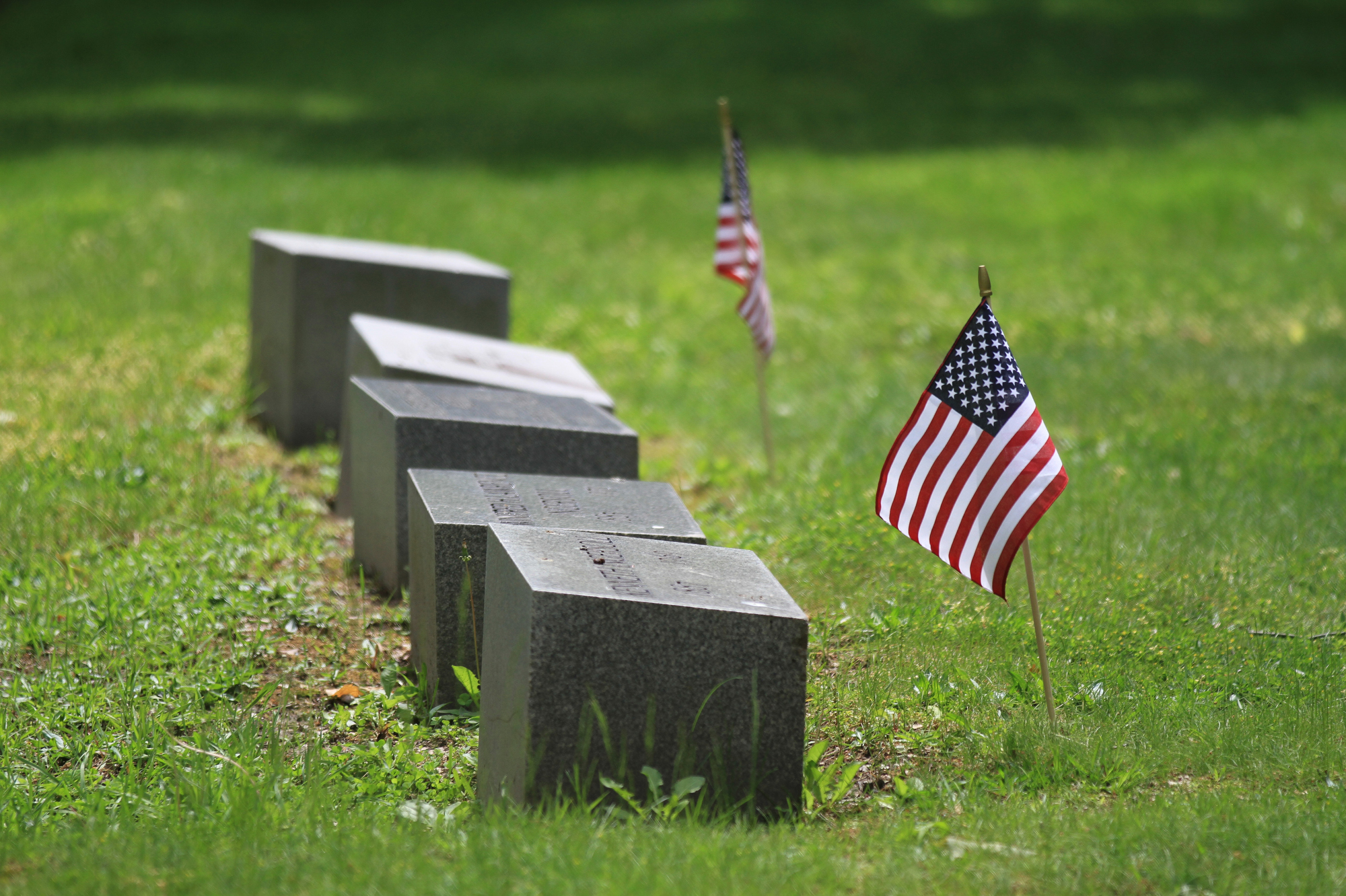 Flags placed on gravesites at Lake View Cemetery for Memorial Day ...