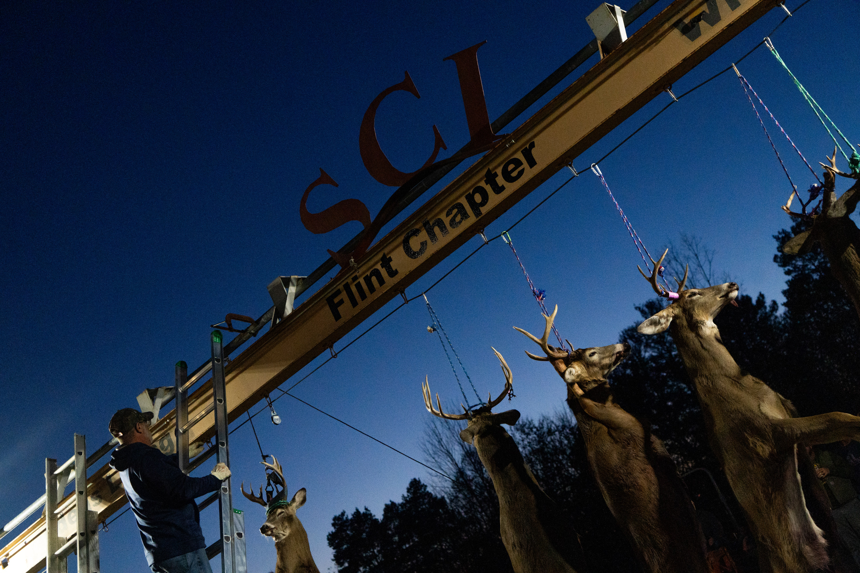 Hunters make their way to the buck poles on opening day - mlive.com