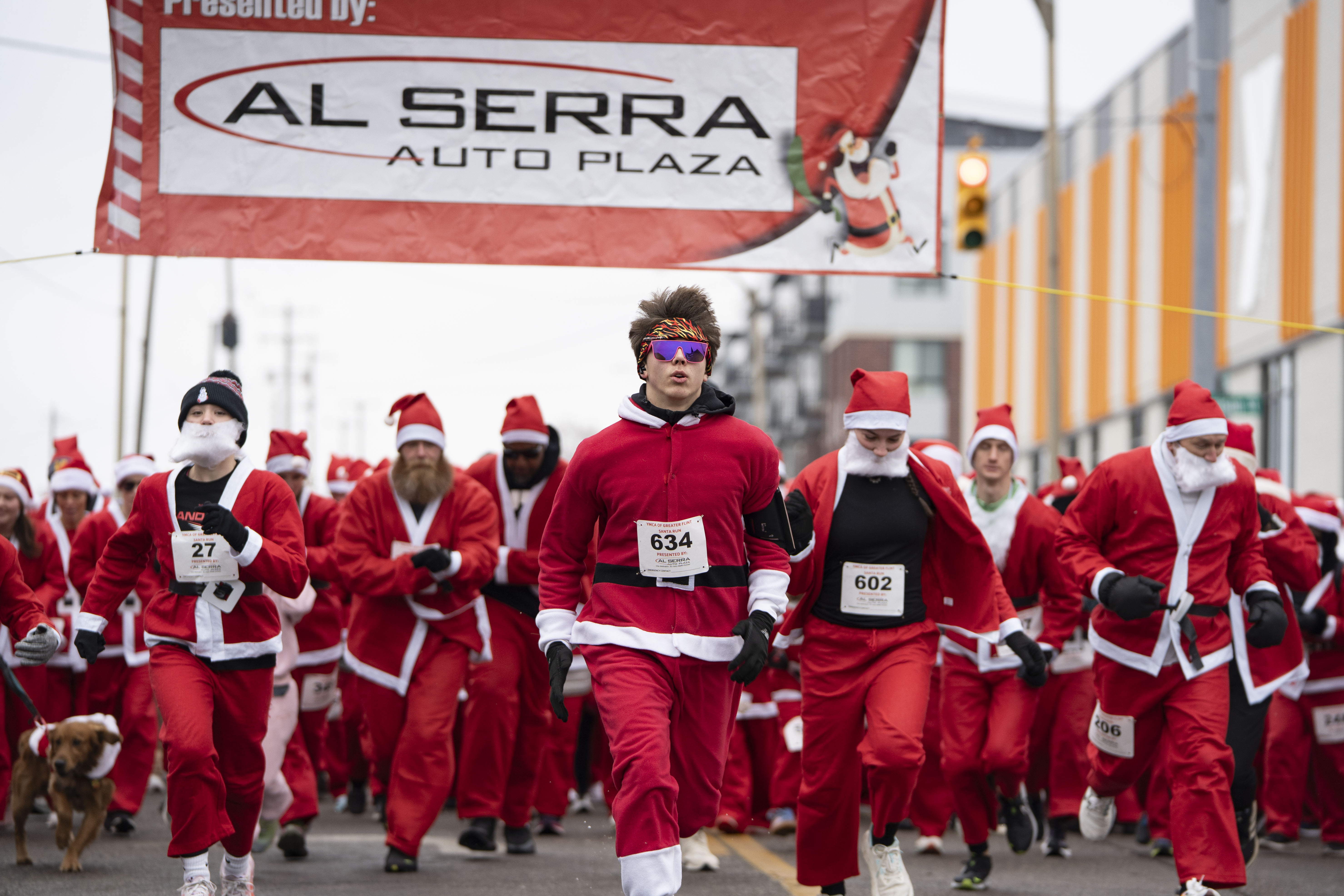 Hundreds put on their red suits for the YMCA Santa Run - mlive.com