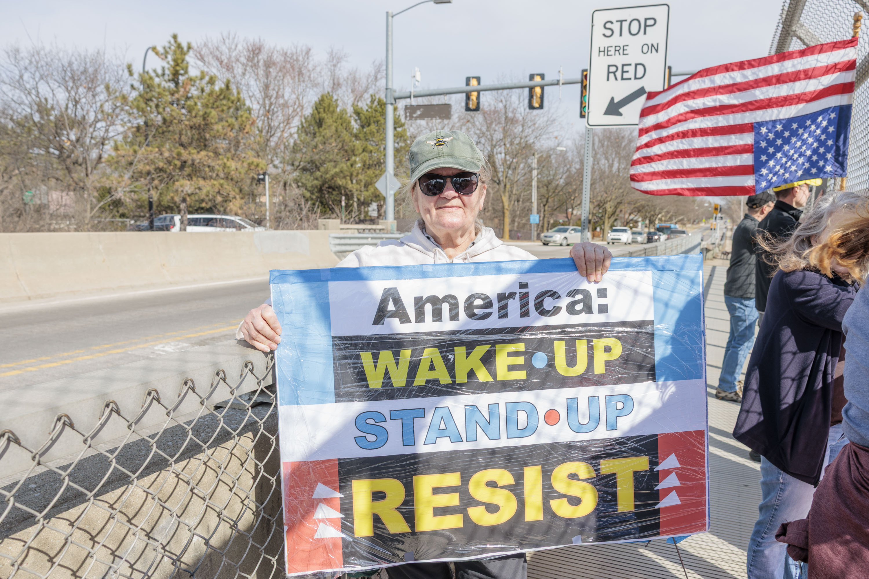 Demonstrators protest Trump Administration on four Ann Arbor pedestrian ...