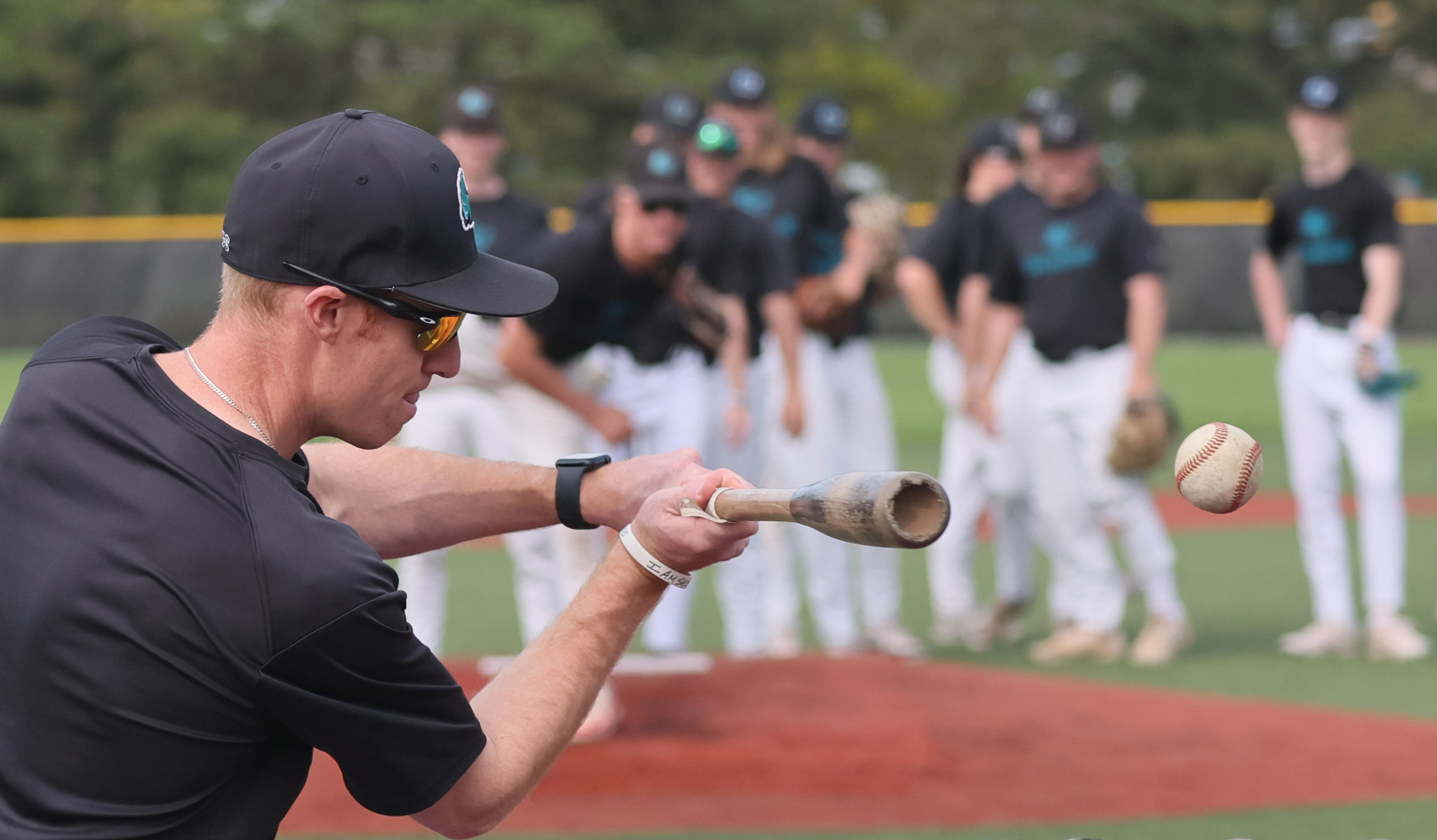 The Tri-C Triceratops baseball team practices before the start of their ...