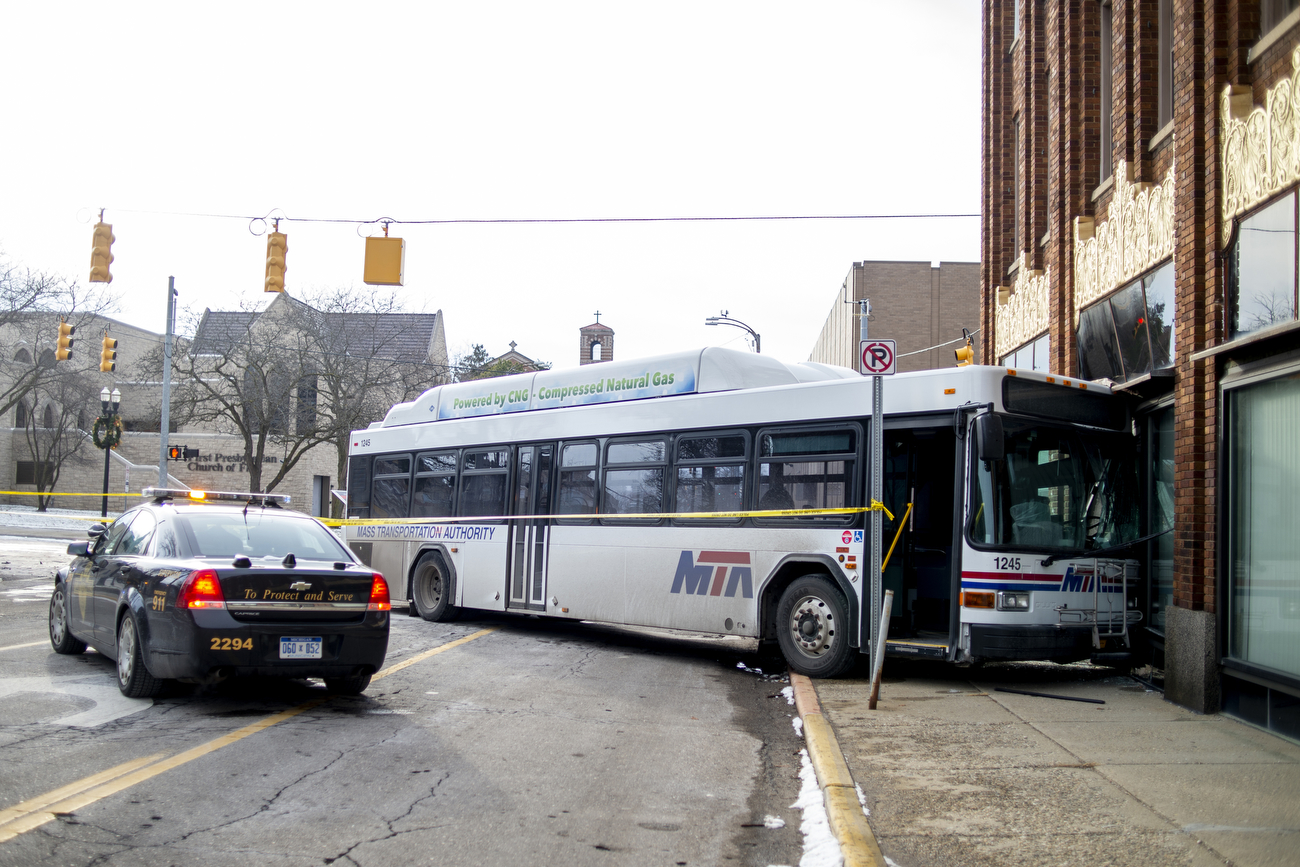 MTA bus crashes into downtown Flint building after collision with SUV ...