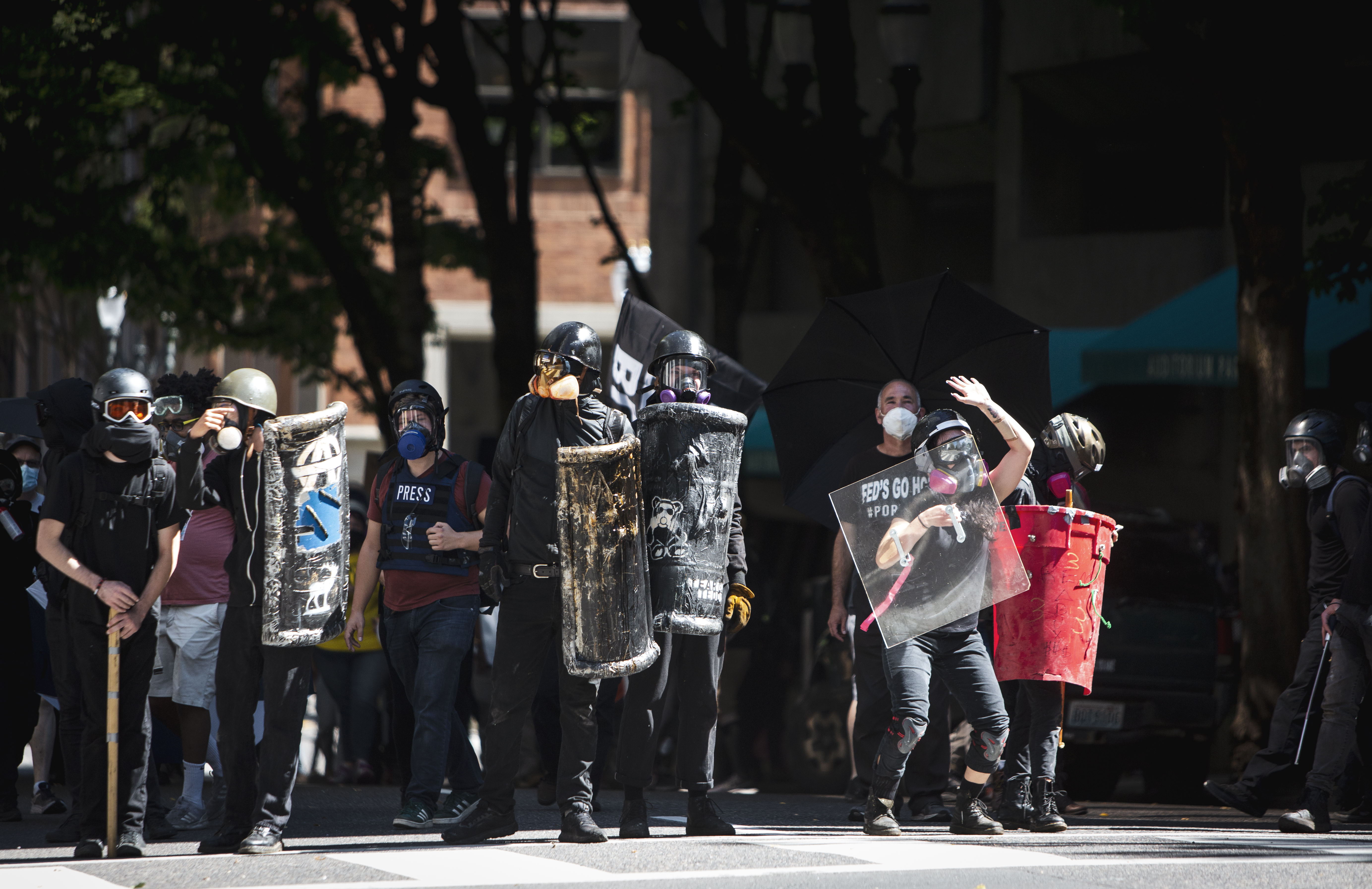 Opposing rallies battle with mace, paint balls and rocks near Justice ...