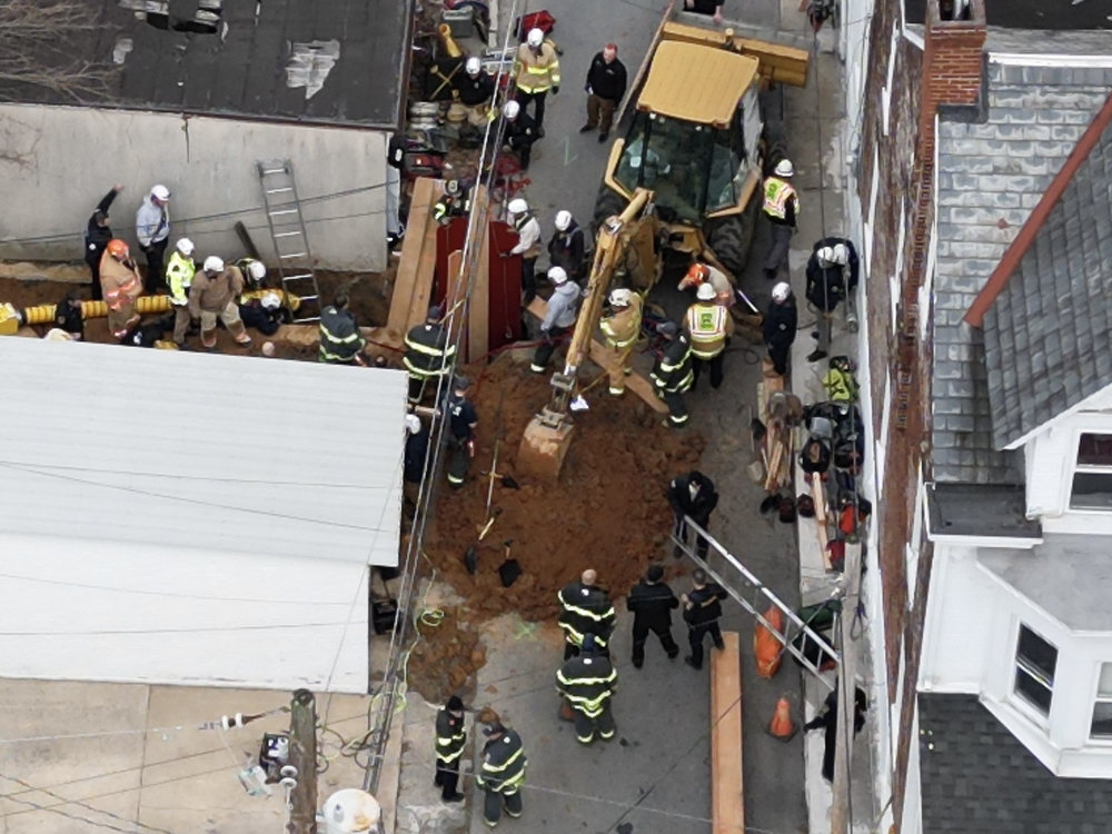 Worker rescued from trench collapse after 8 hours as temperatures ...