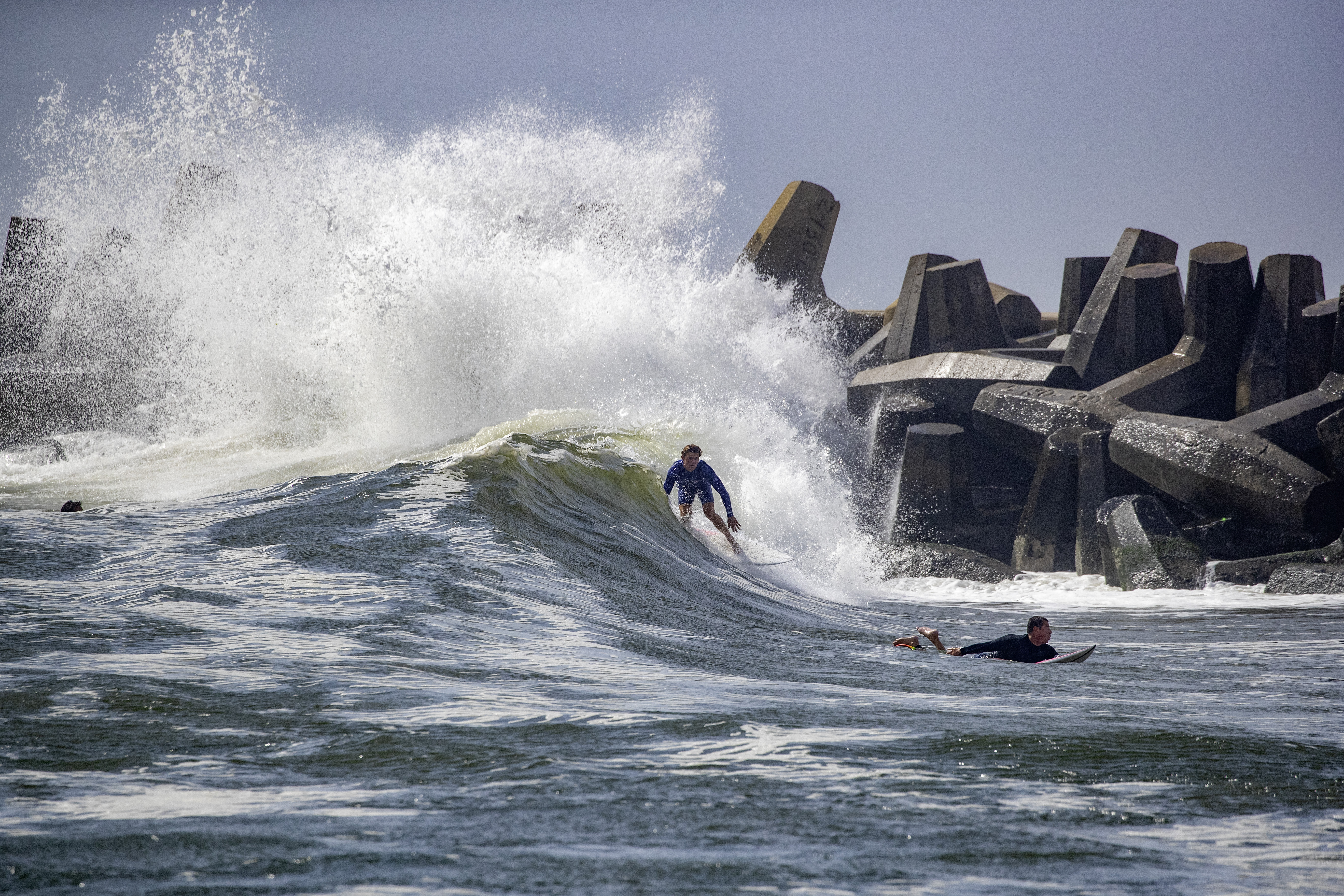 Surfers ride waves on sandbar inside Manasquan Inlet - nj.com
