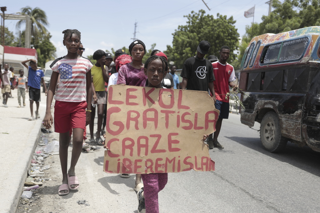 Alix Dorsainvil, a nurse who works for El Roi Haiti, and her daughter ...