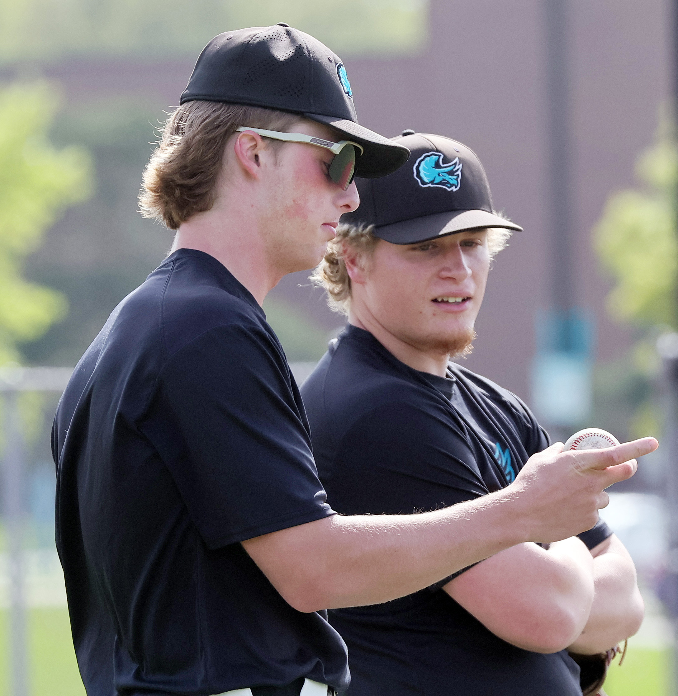 The Tri-C Triceratops baseball team practices before the start of their ...