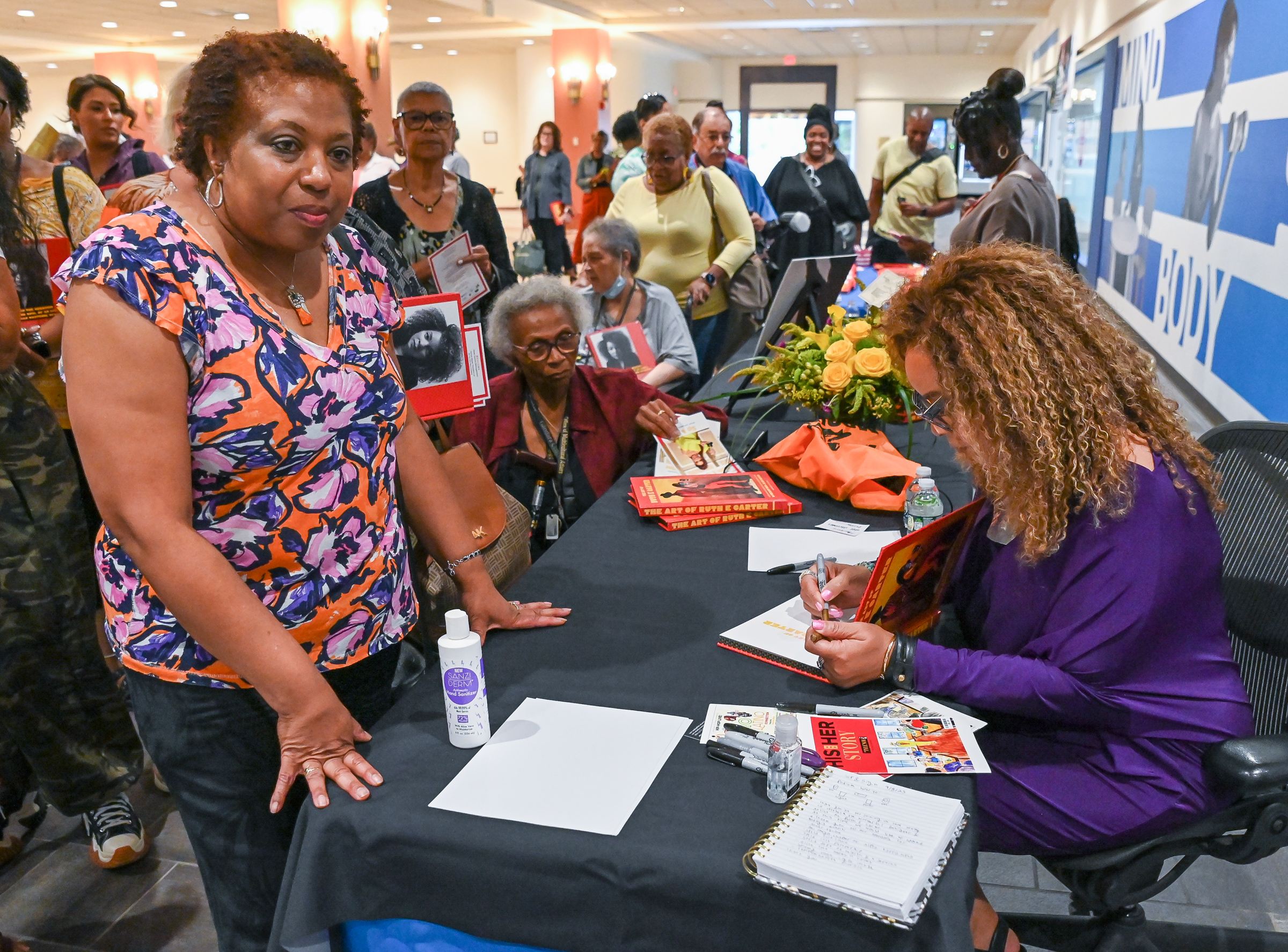 Author and Oscar Award winner Ruth E. Carte draws fans at the Sip ...