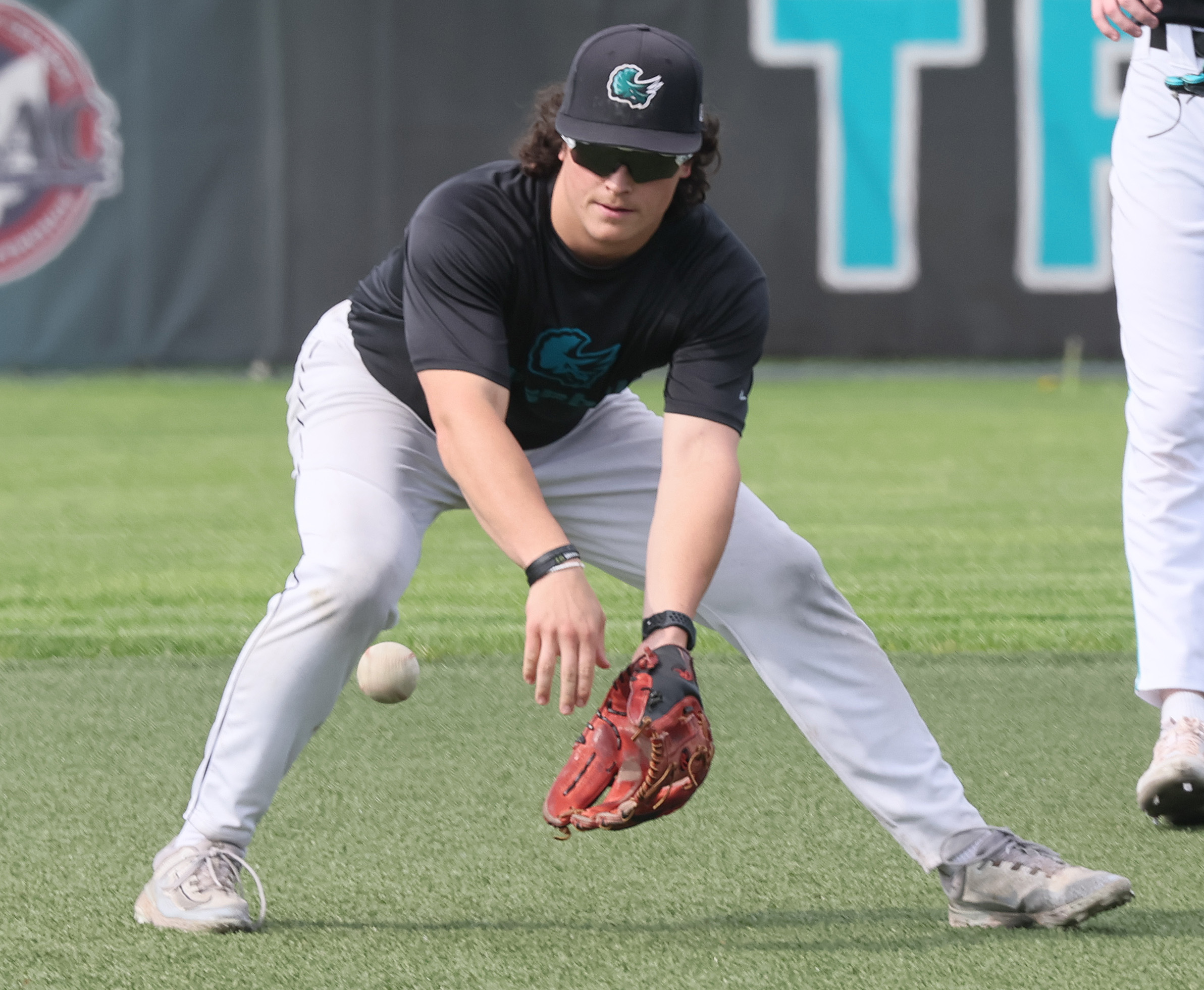 The Tri-C Triceratops baseball team practices before the start of their ...