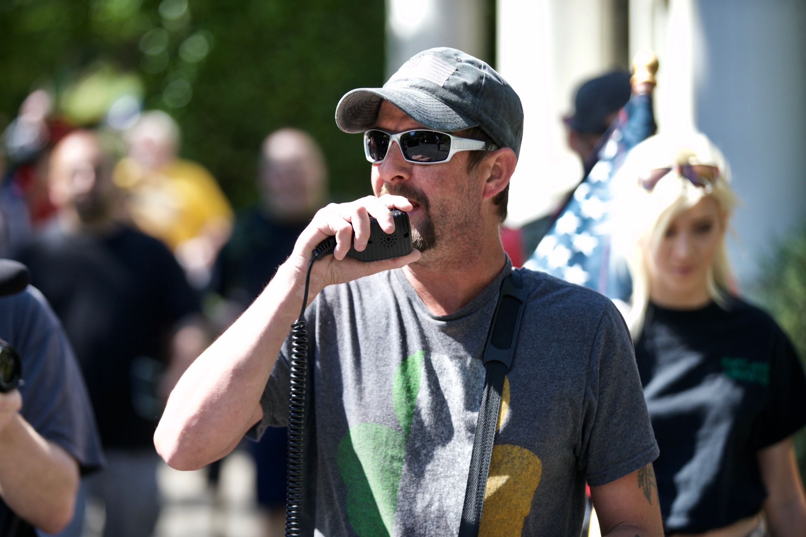 Demonstrators gather outside Portland Mayor Ted Wheeler's house ...