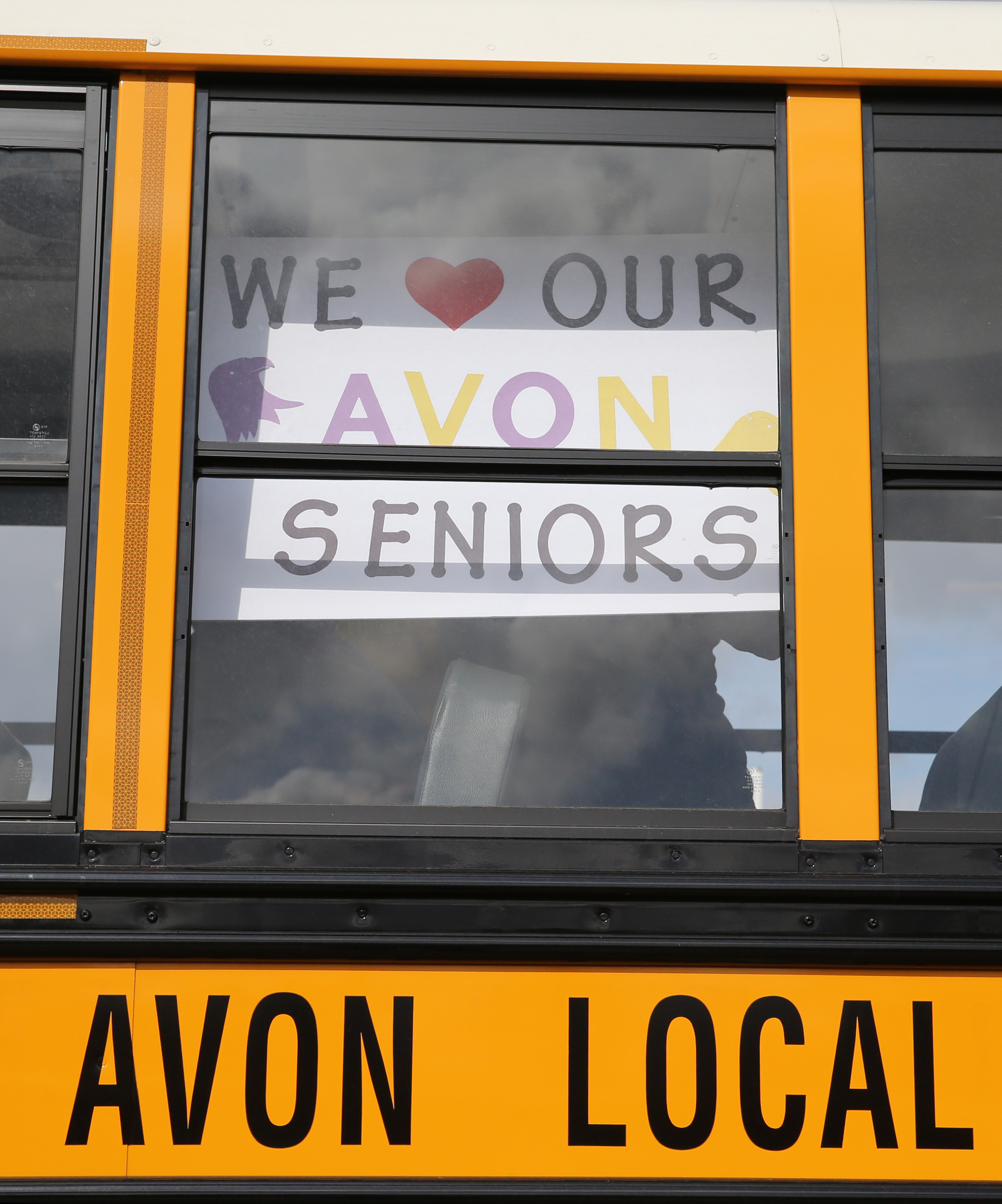 Avon High School uses school buses to deliver senior graduation signs ...