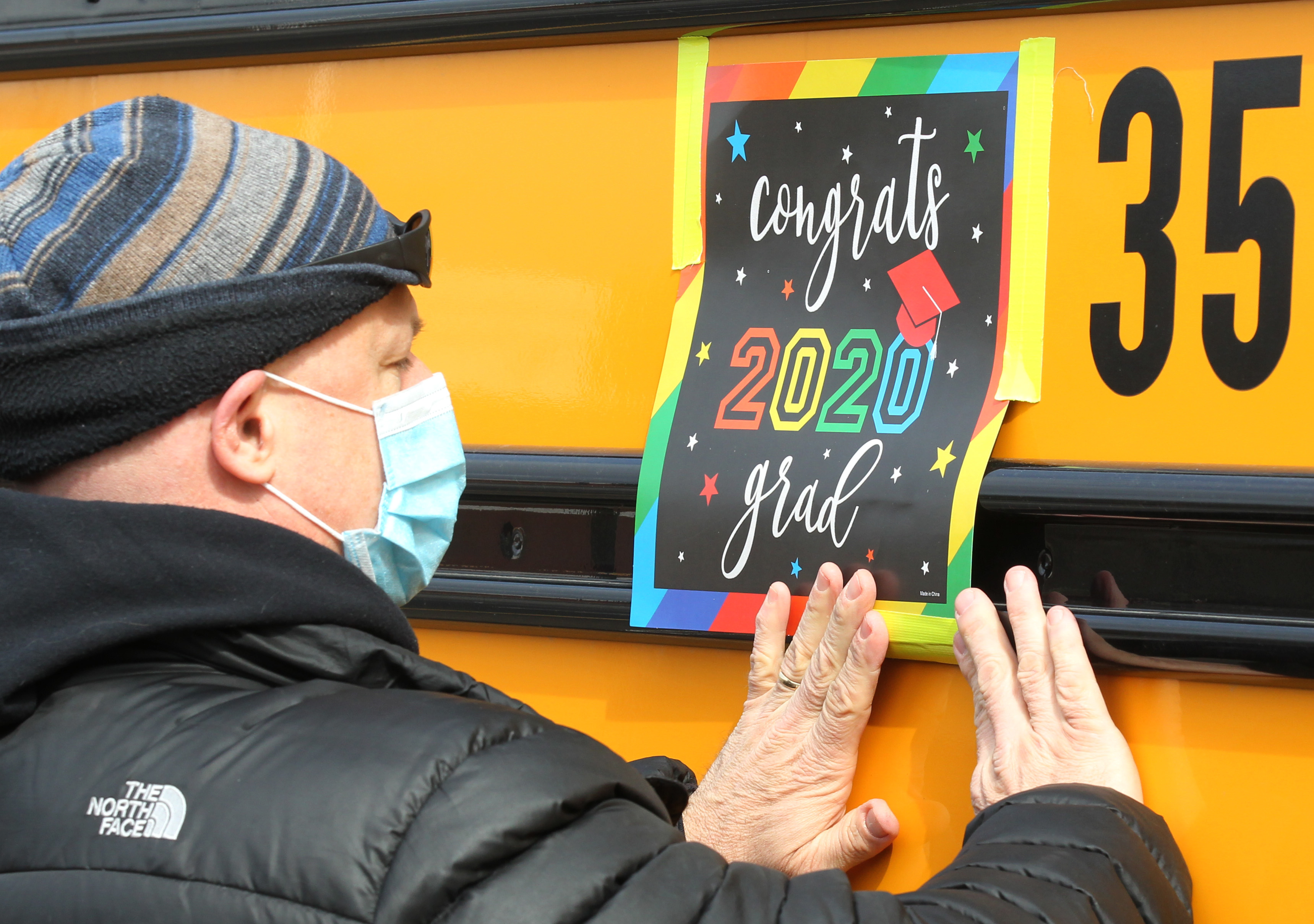 Avon High School uses school buses to deliver senior graduation signs ...