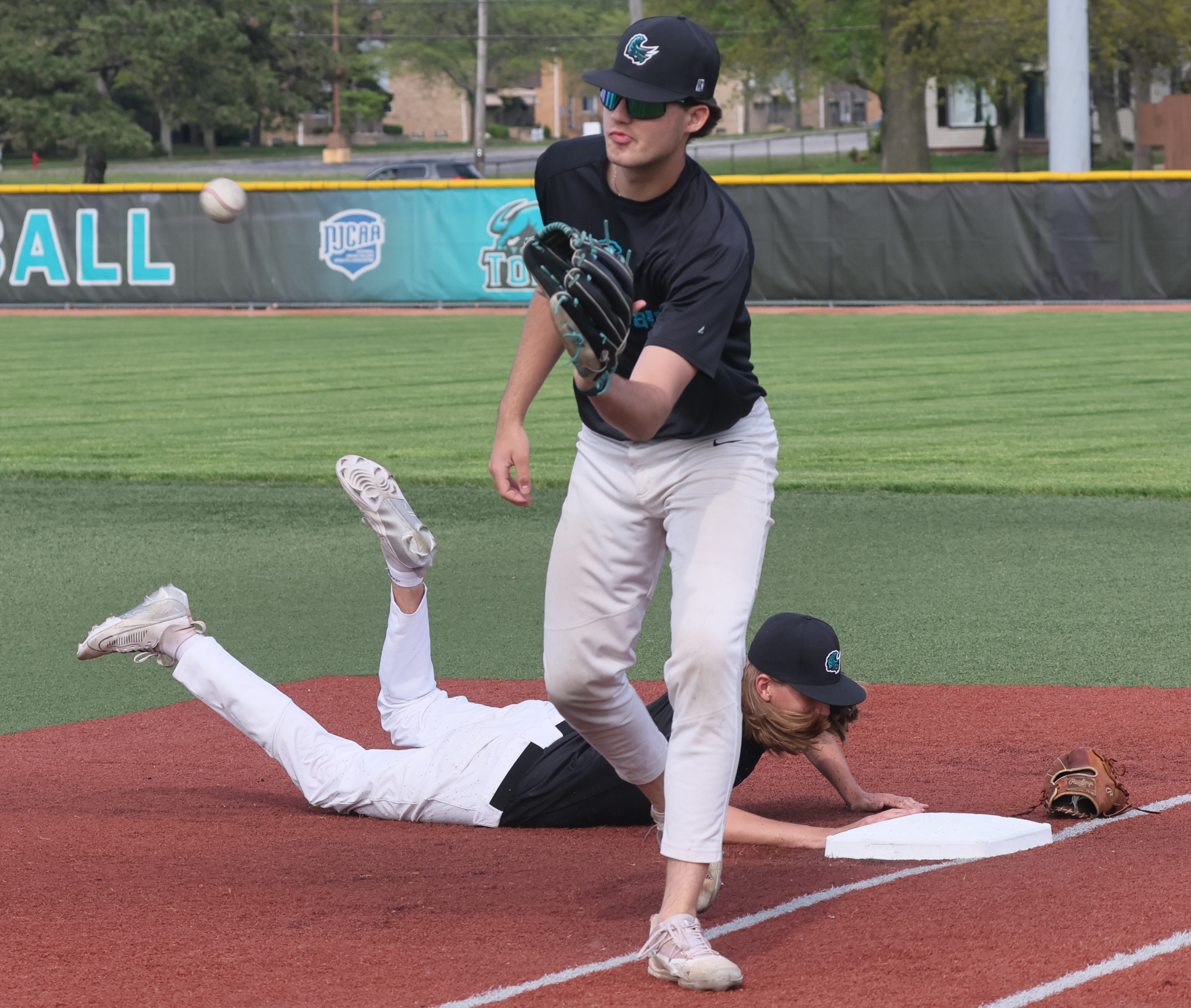 The Tri-C Triceratops baseball team practices before the start of their ...
