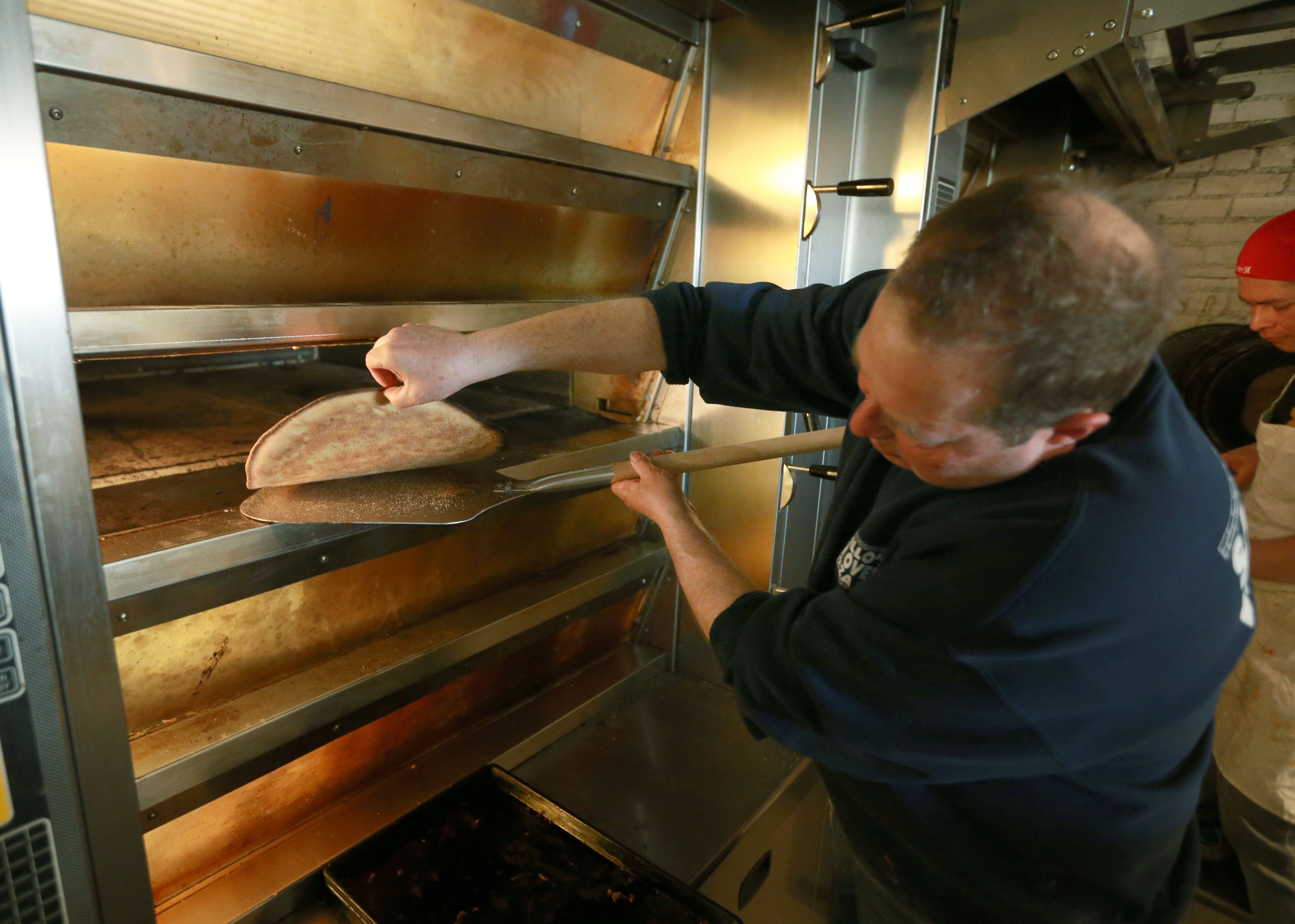 Pizza maker Al Santillo is making pizza at Coniglio’s as his place is ...