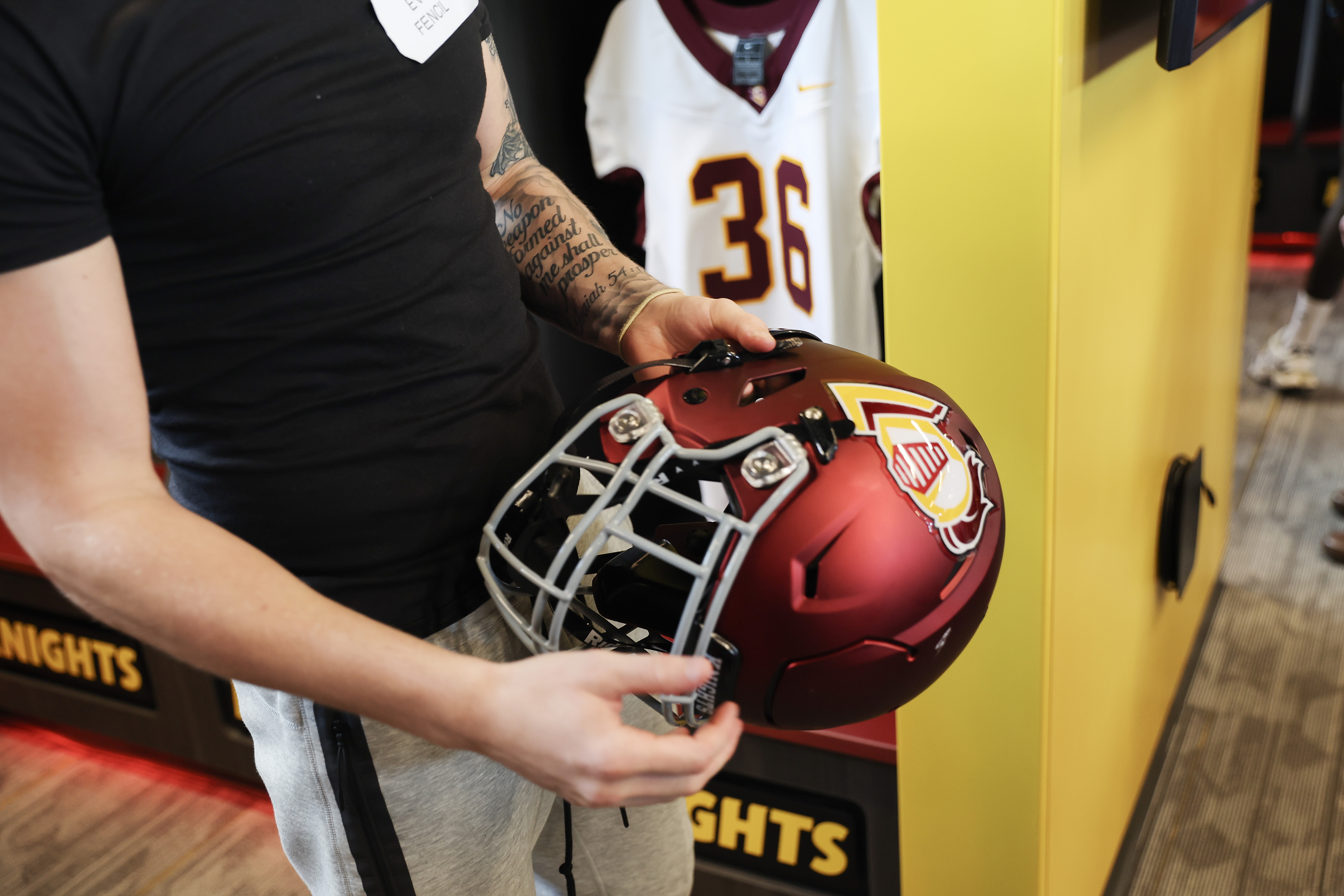 Calvin football players see their newly built locker room for the first ...