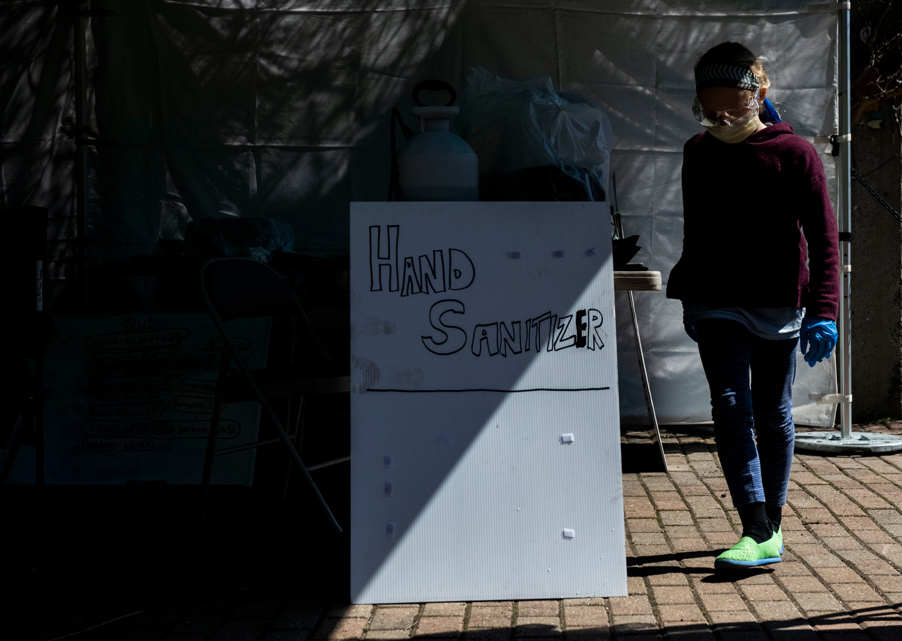 Kevin Leeser and his children prepare shields for healthcare workers ...