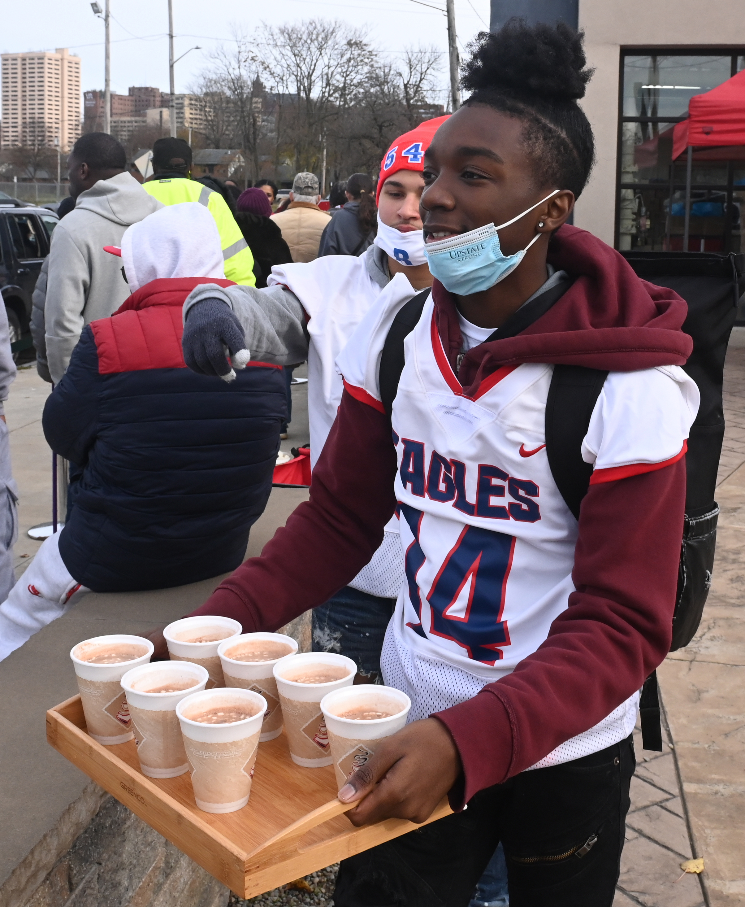 ITC High School football players help with turkey give-a-way - syracuse.com