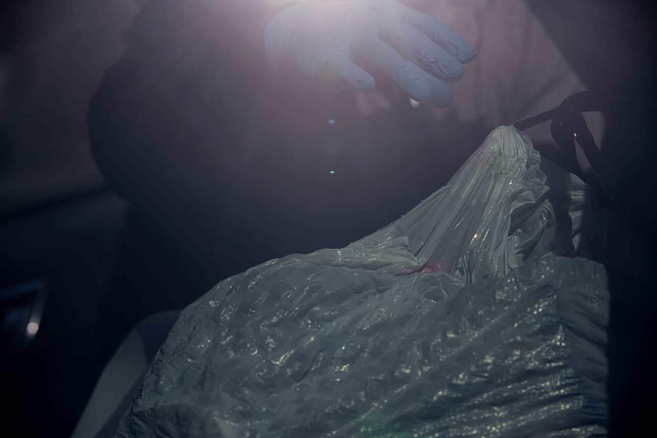 Kevin Leeser and his children prepare shields for healthcare workers ...
