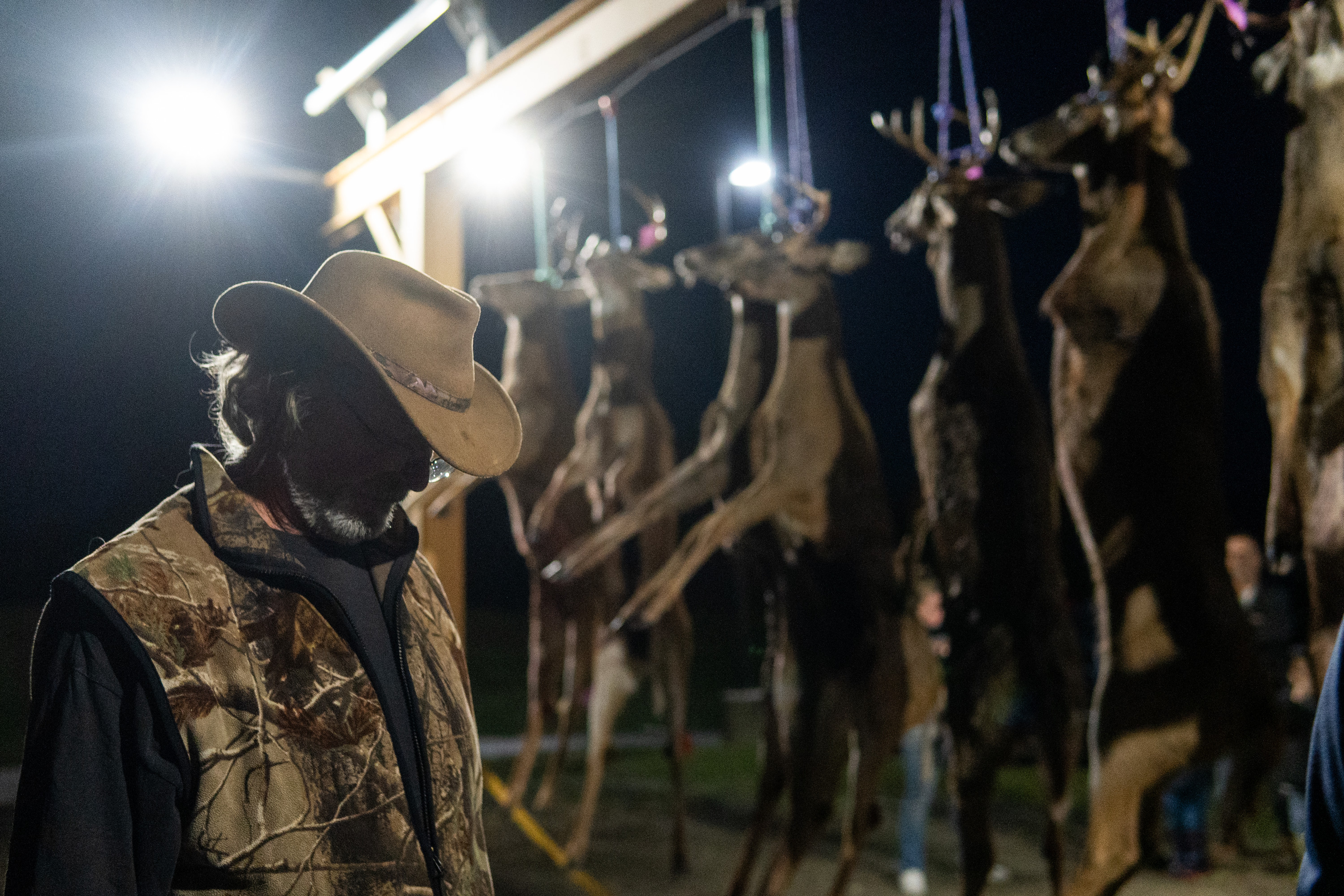 Hunters make their way to the buck poles on opening day - mlive.com