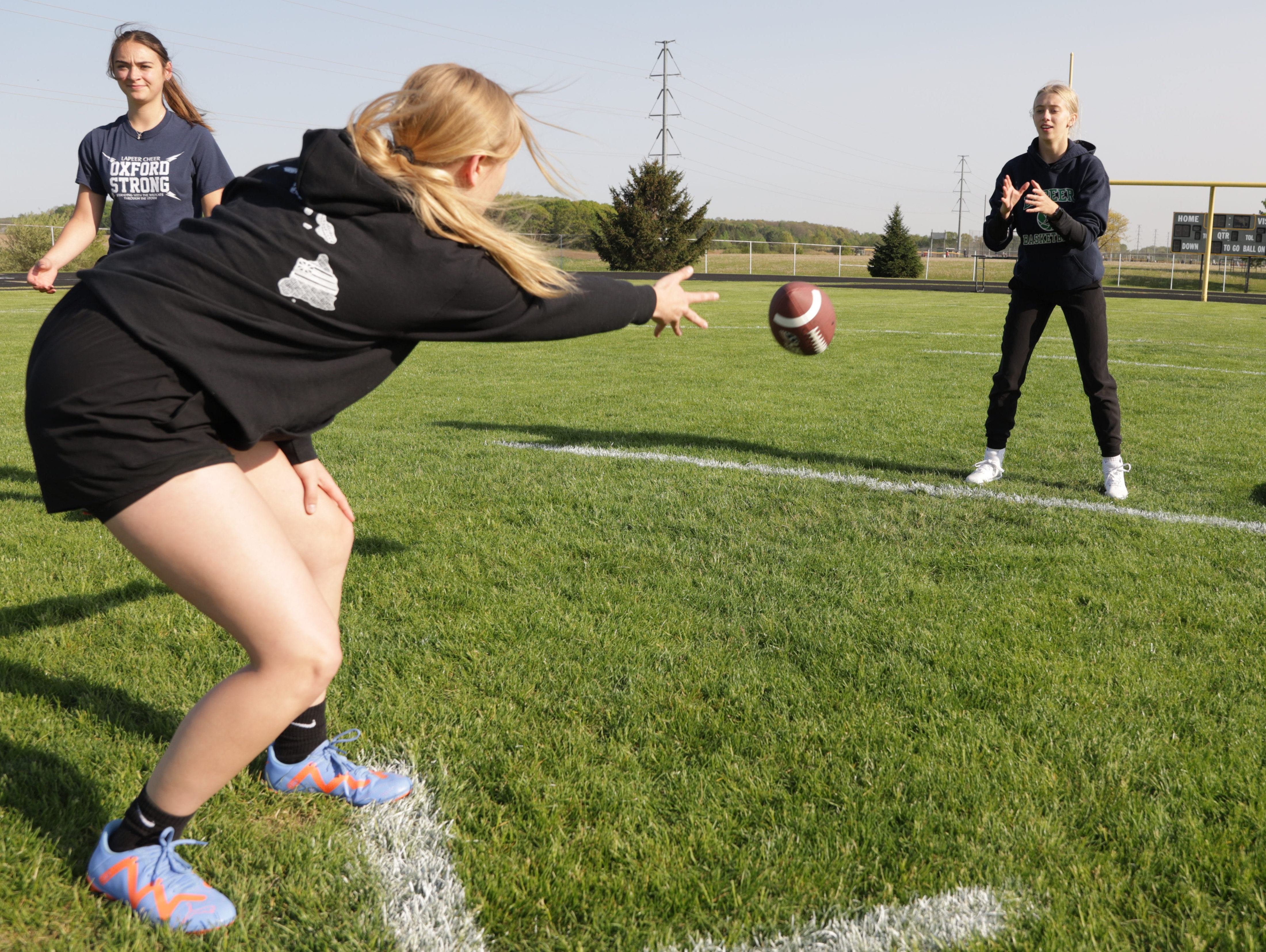 Lapeer high school girls participate in flag football pilot league ...