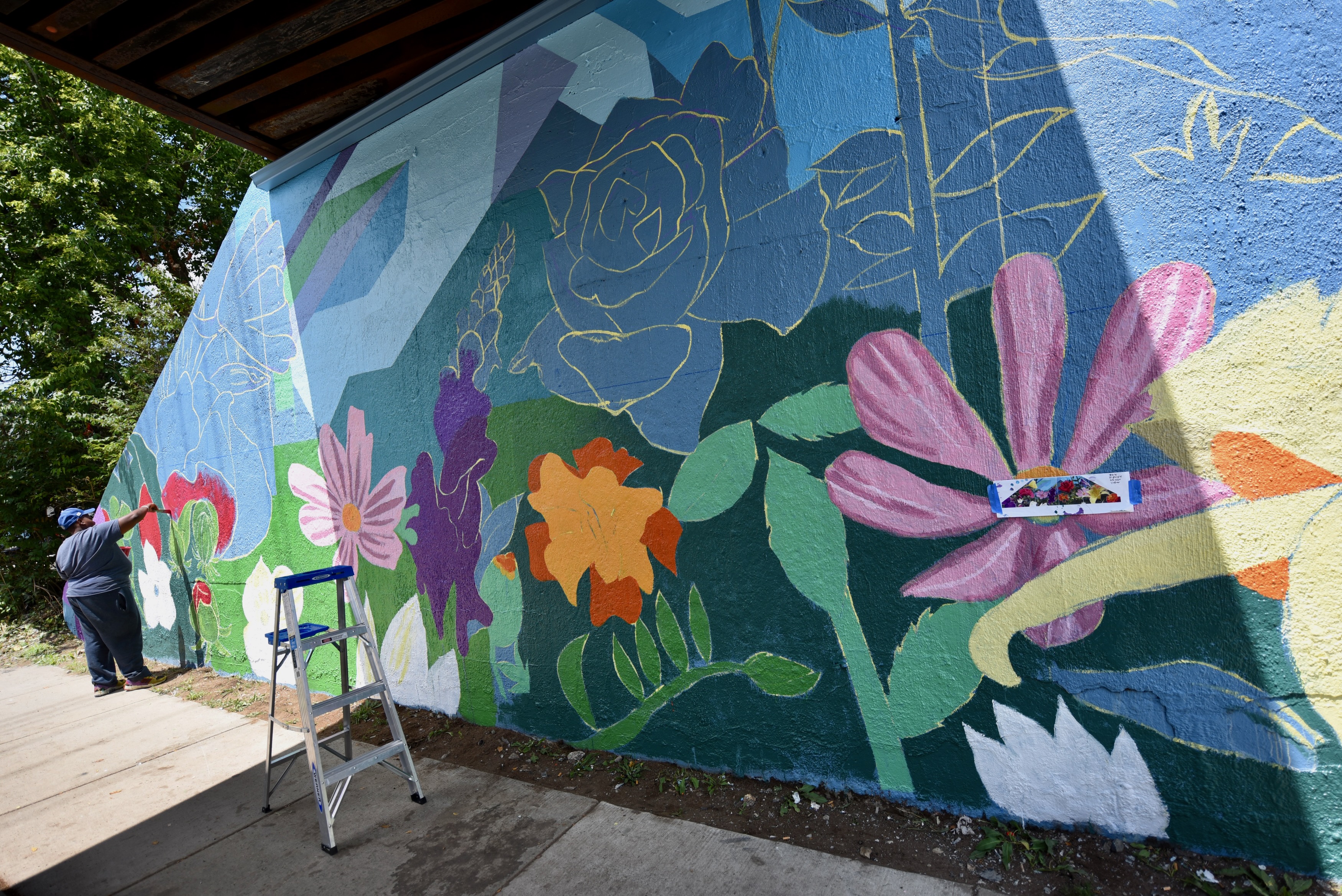 TreeTown Murals community paint day activity with Delonis Center ...