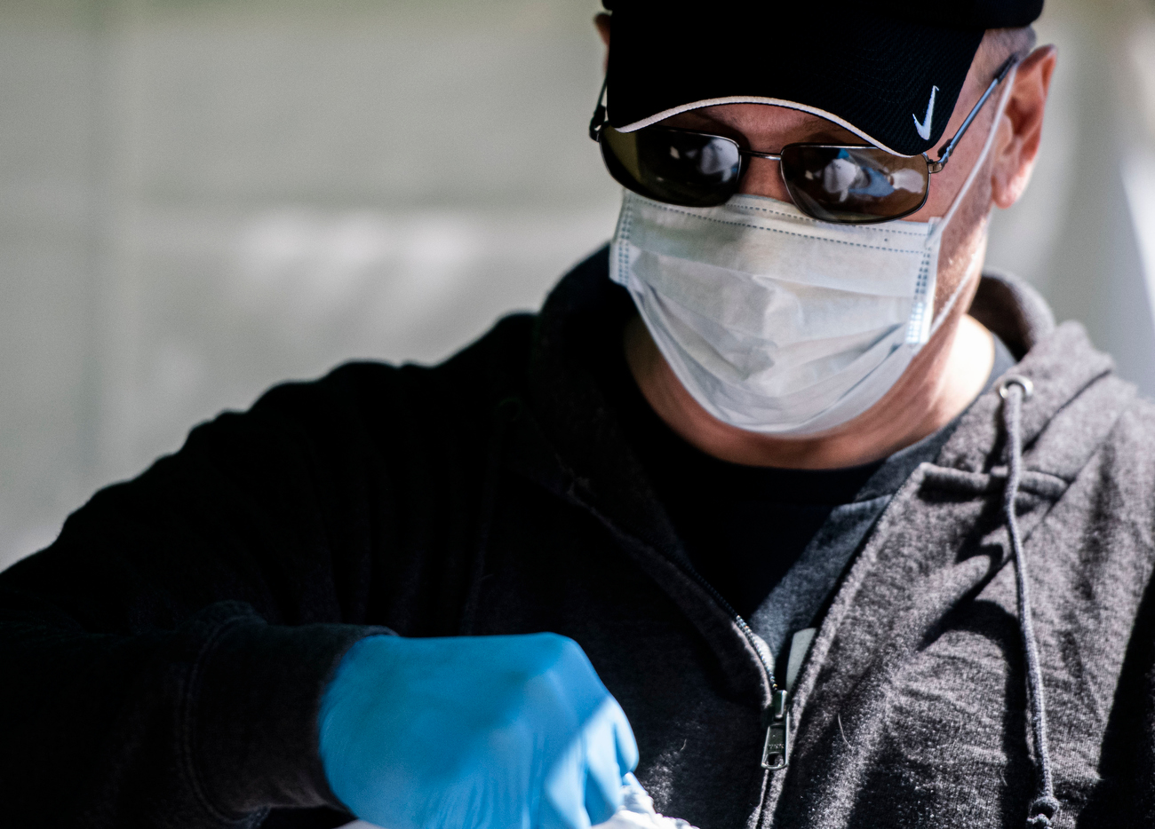 Kevin Leeser and his children prepare shields for healthcare workers ...