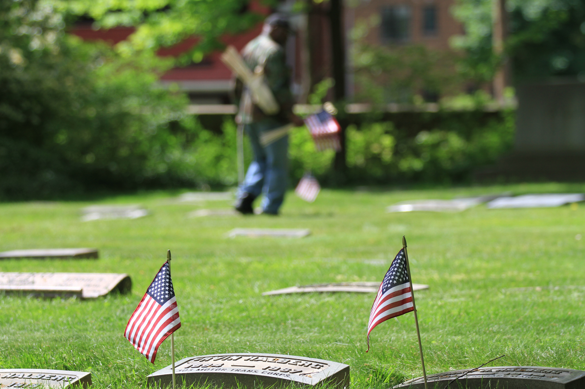 Flags placed on gravesites at Lake View Cemetery for Memorial Day ...