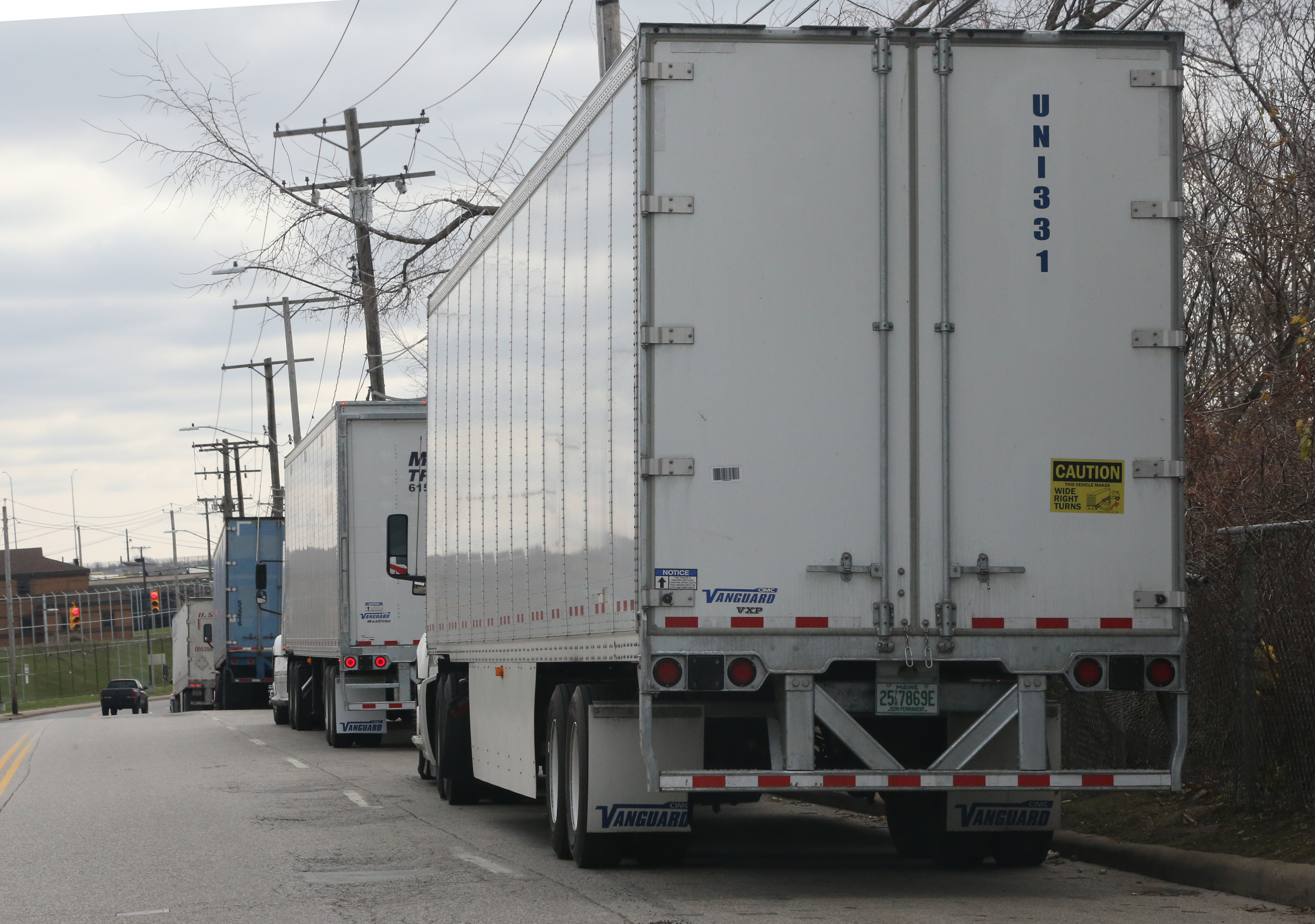 Trucks wait to unload USPS packages at Cleveland distribution center ...
