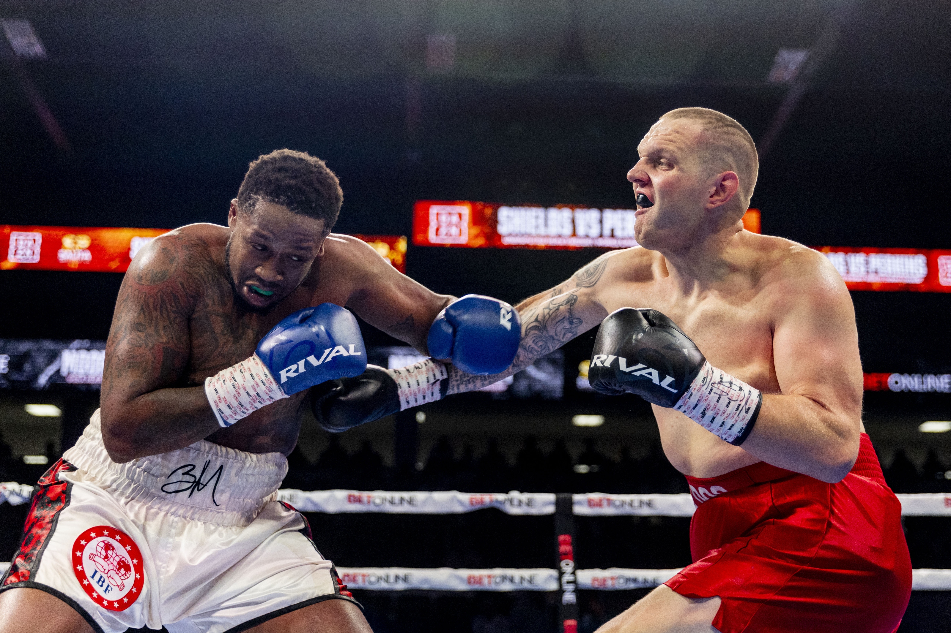 Boxers fly out of the ring and into crowd in WWE style at Michigan bout ...