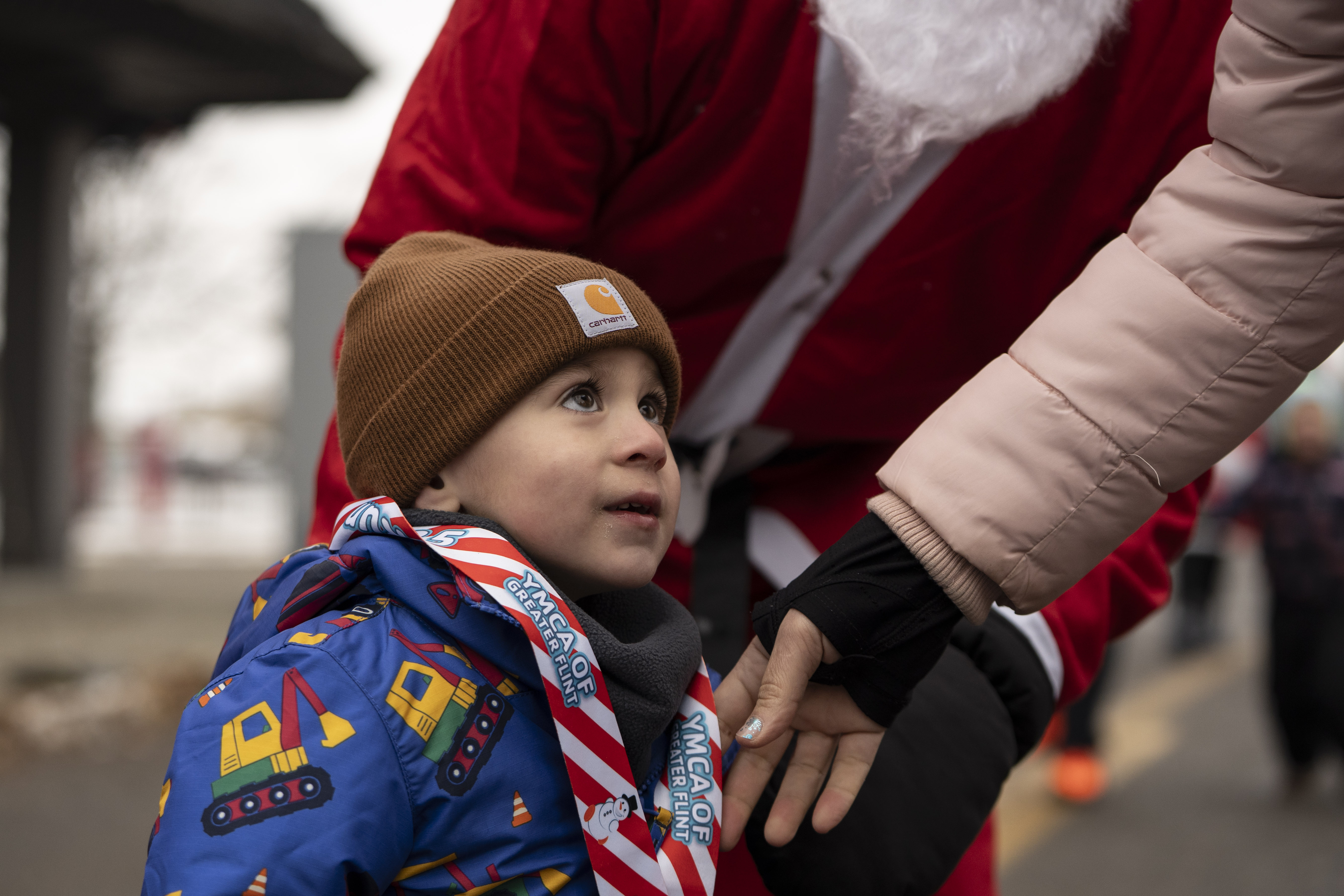 Hundreds put on their red suits for the YMCA Santa Run - mlive.com