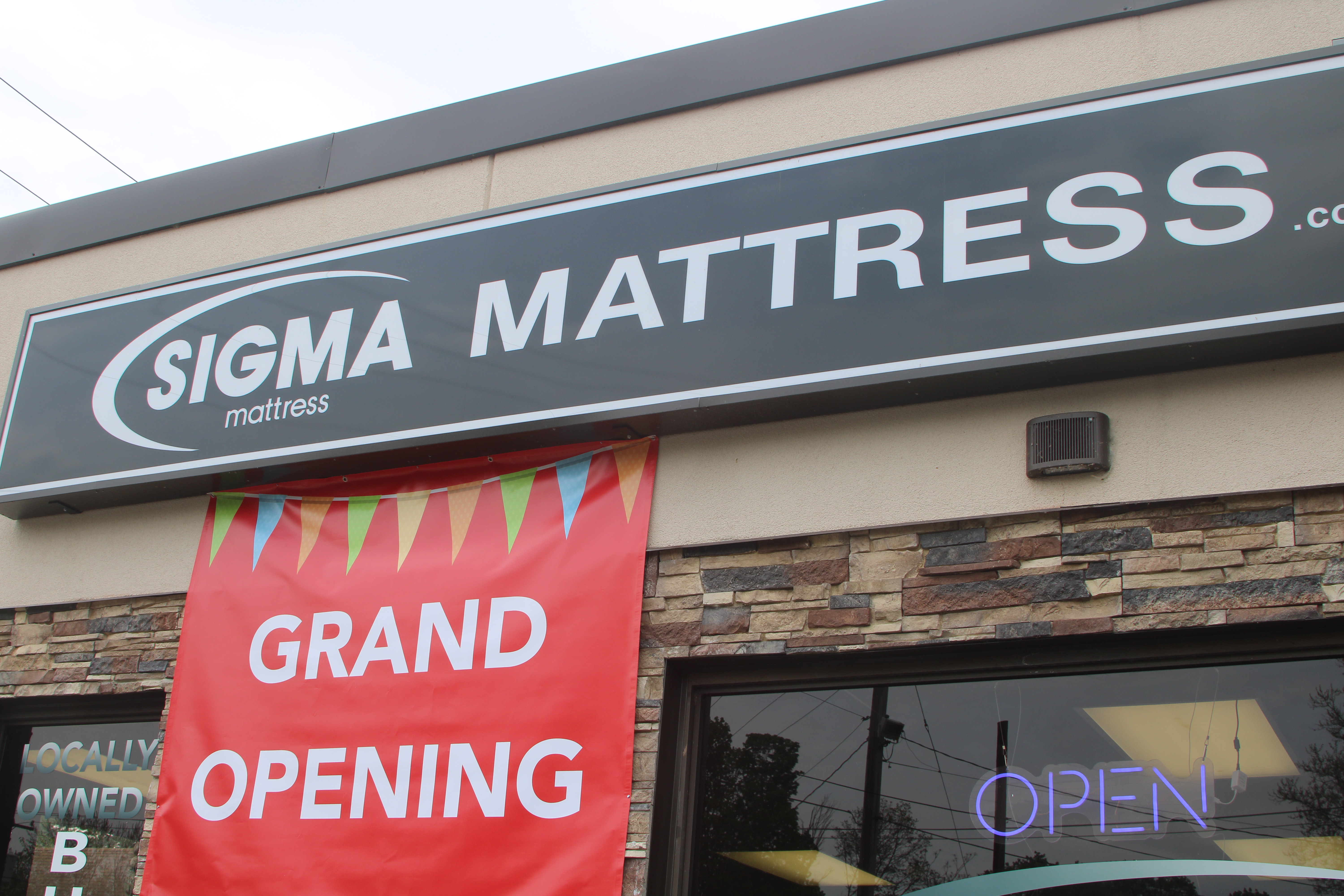 Sigma Mattress Ribbon Cutting 5-6 - masslive.com