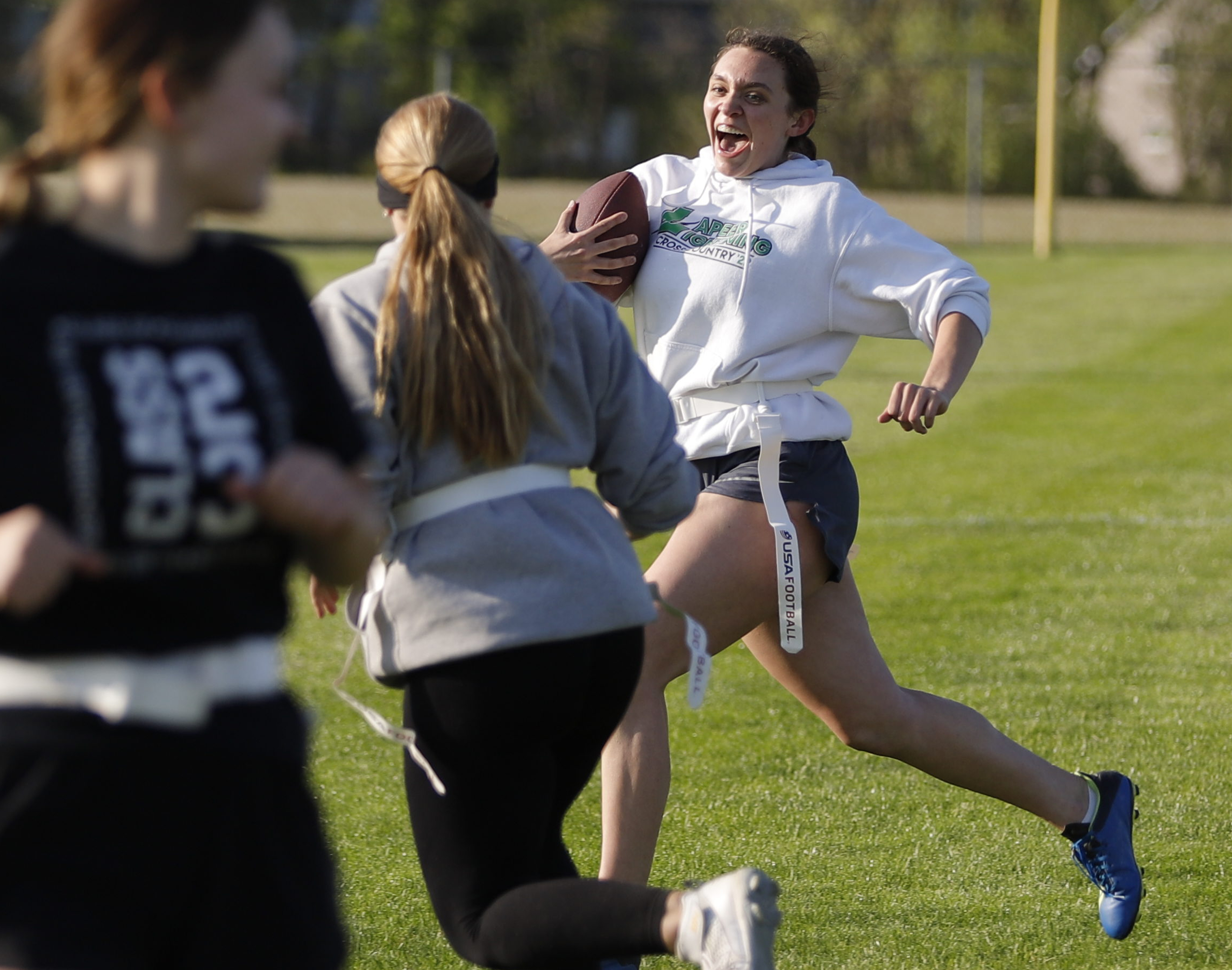 Lapeer high school girls participate in flag football pilot league ...